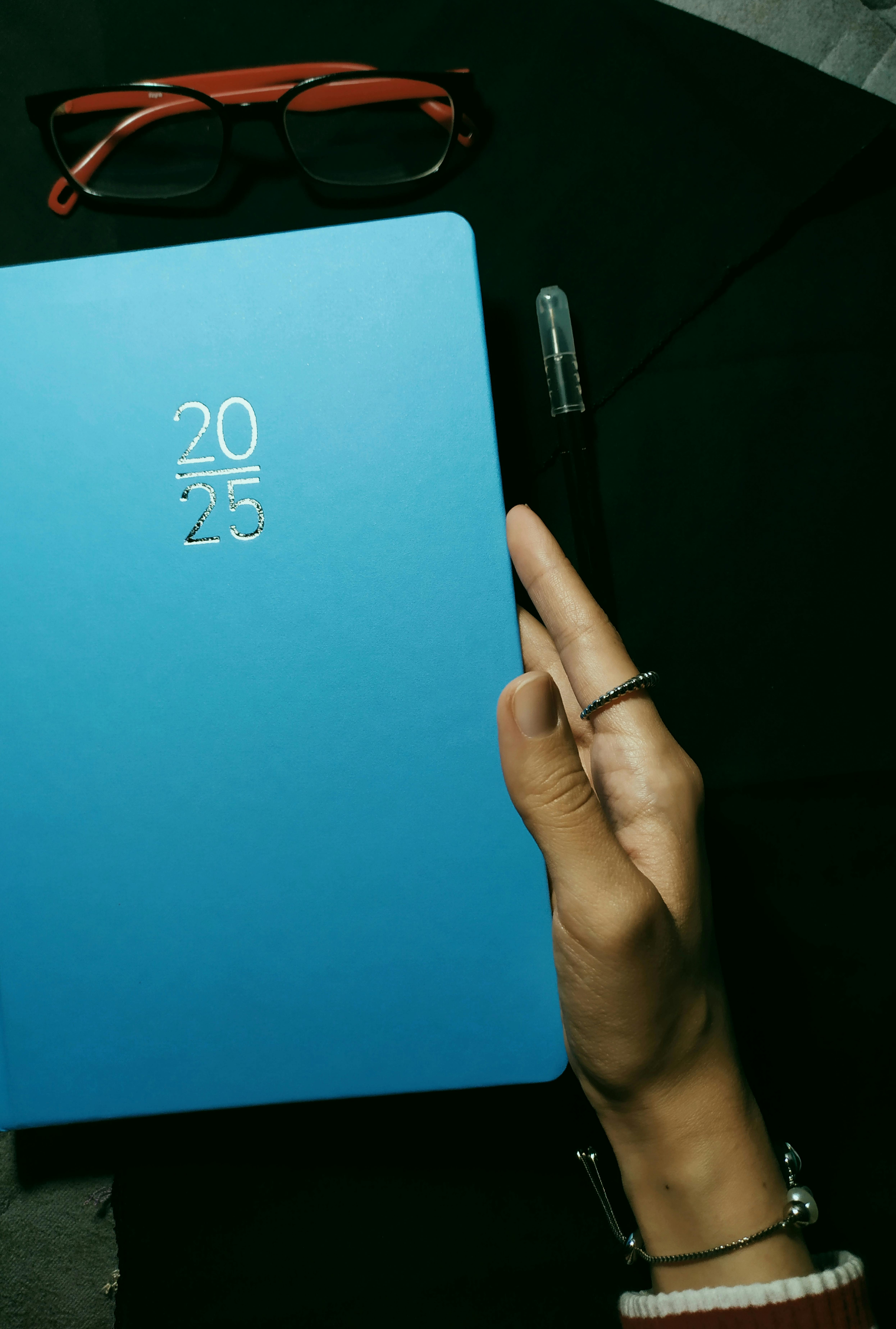 Stylish Planner and Pen with Eyeglasses · Free Stock Photo