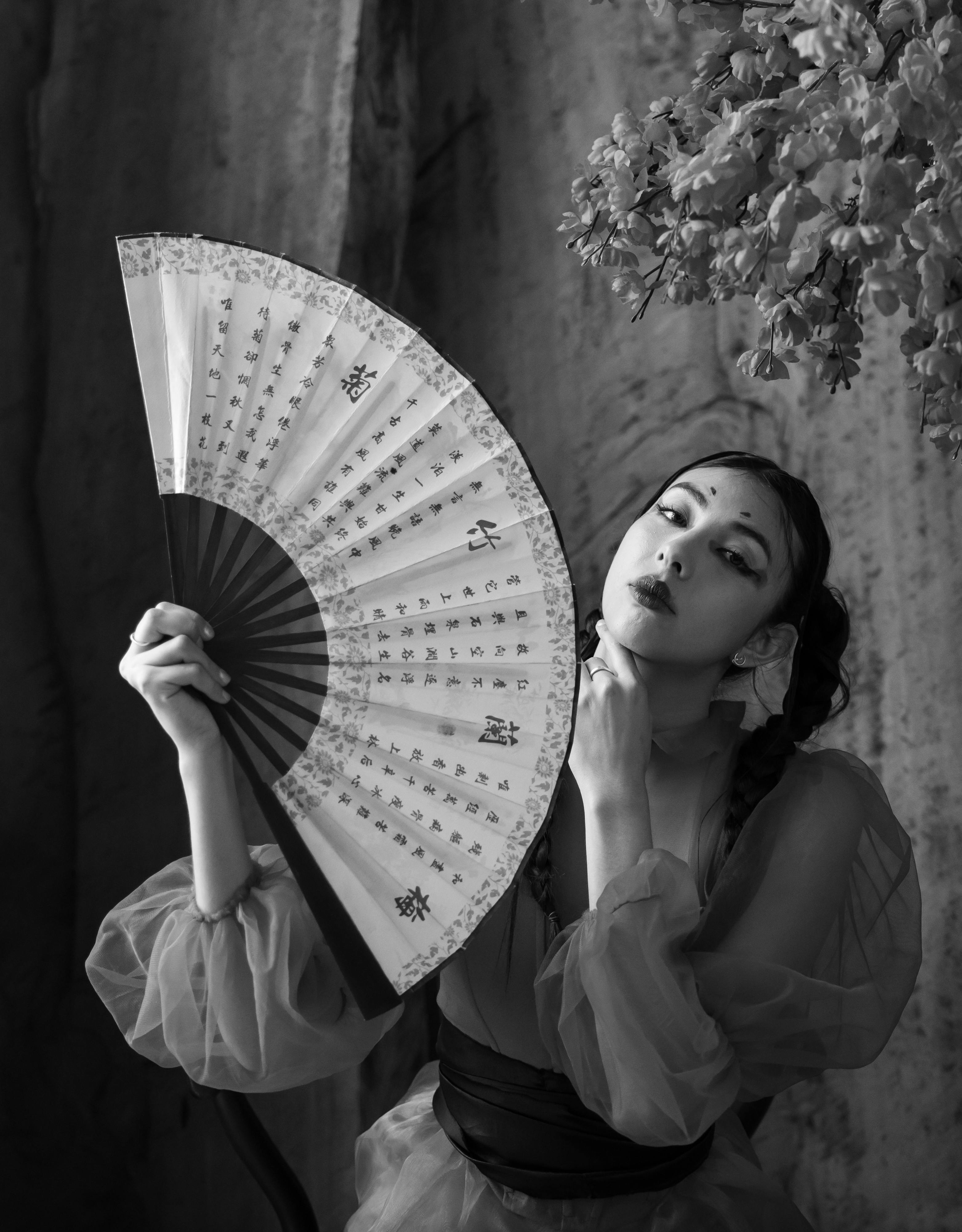 Elegant Portrait of Woman Holding Traditional Fan · Free Stock Photo