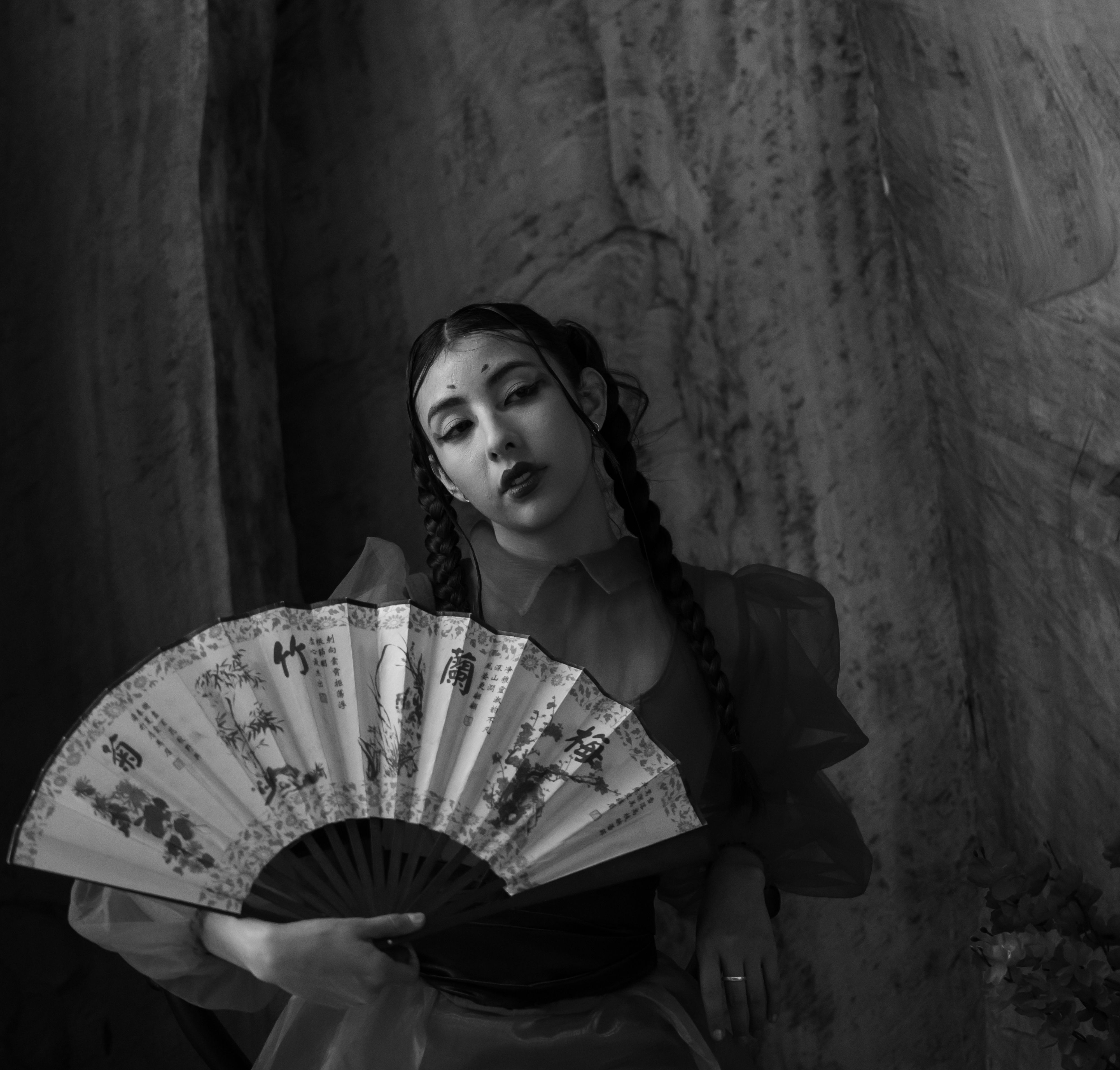 Black and White Portrait with Traditional Fan · Free Stock Photo