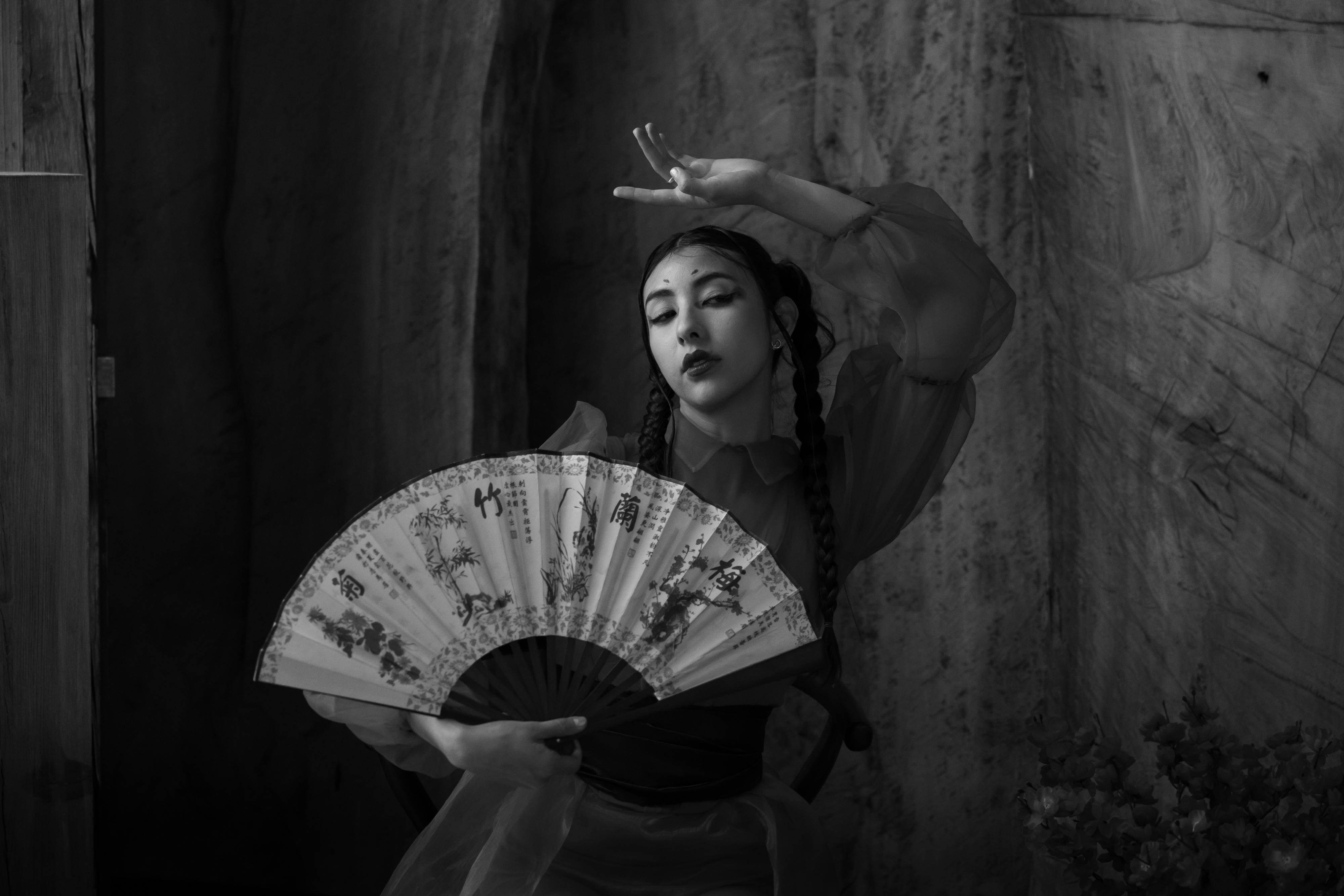 Black and White Artistic Portrait with Fan · Free Stock Photo