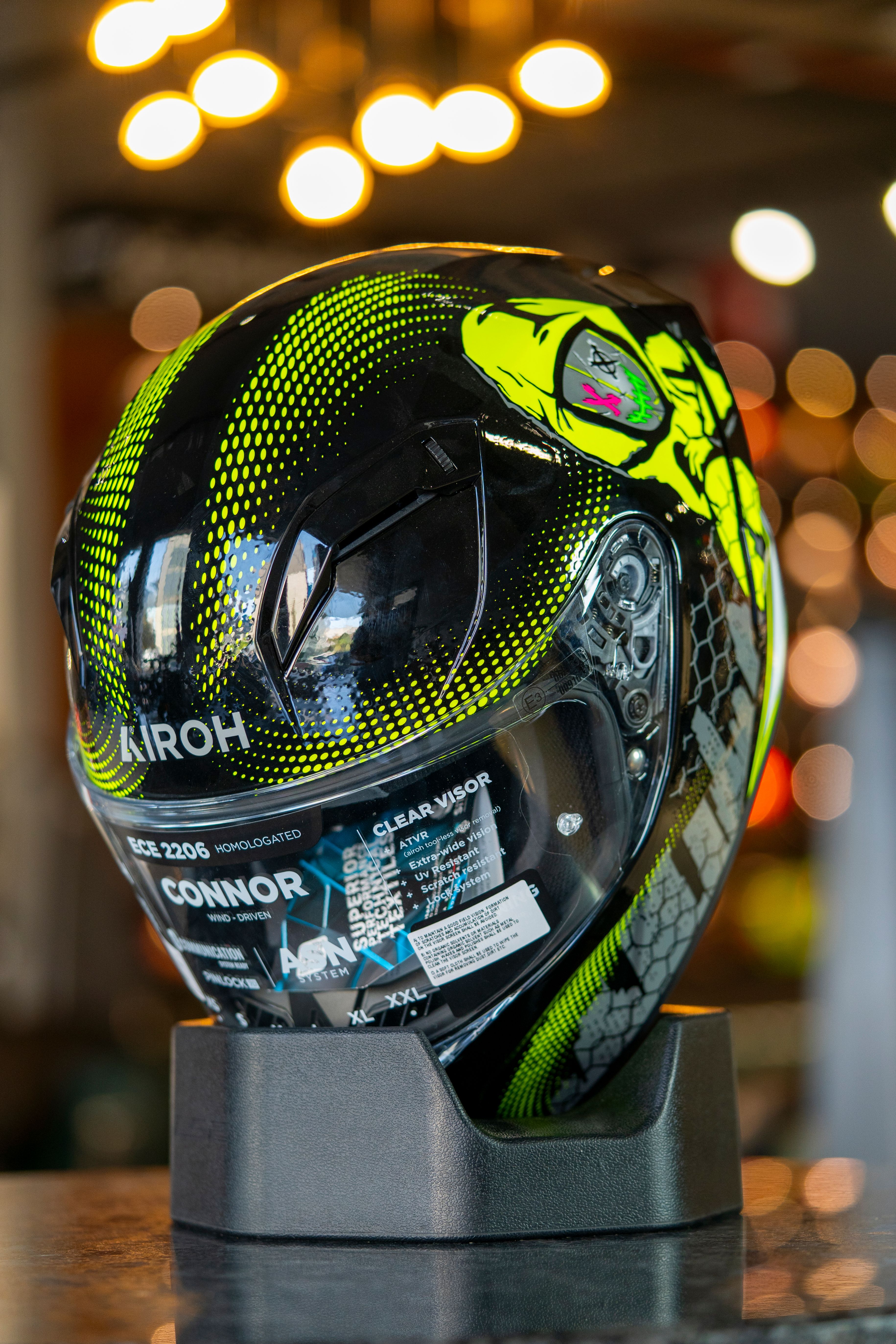 Colorful Racing Helmet on Display in Modern Setting · Free Stock Photo