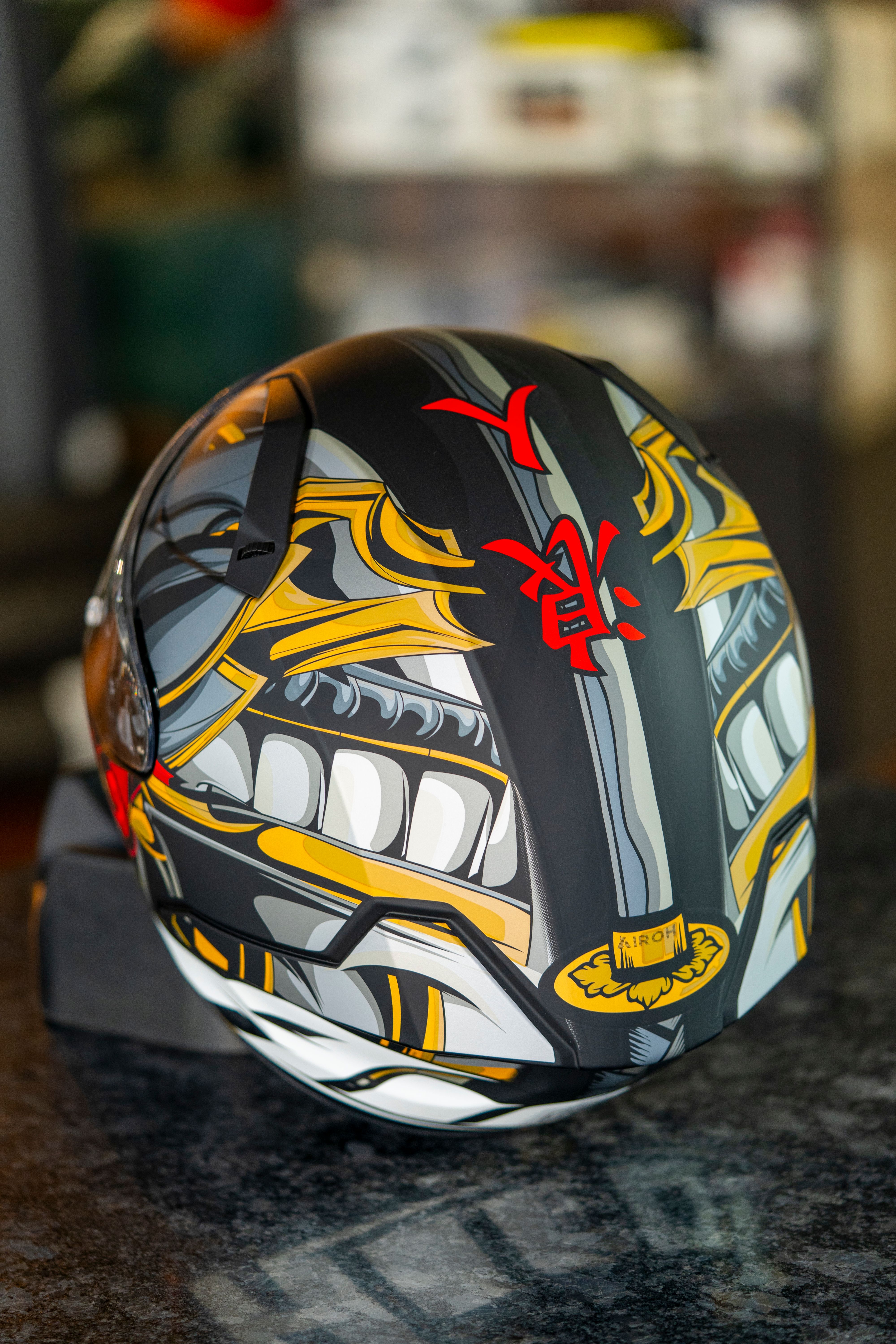 Colorful Artistic Motorcycle Helmet on Display · Free Stock Photo
