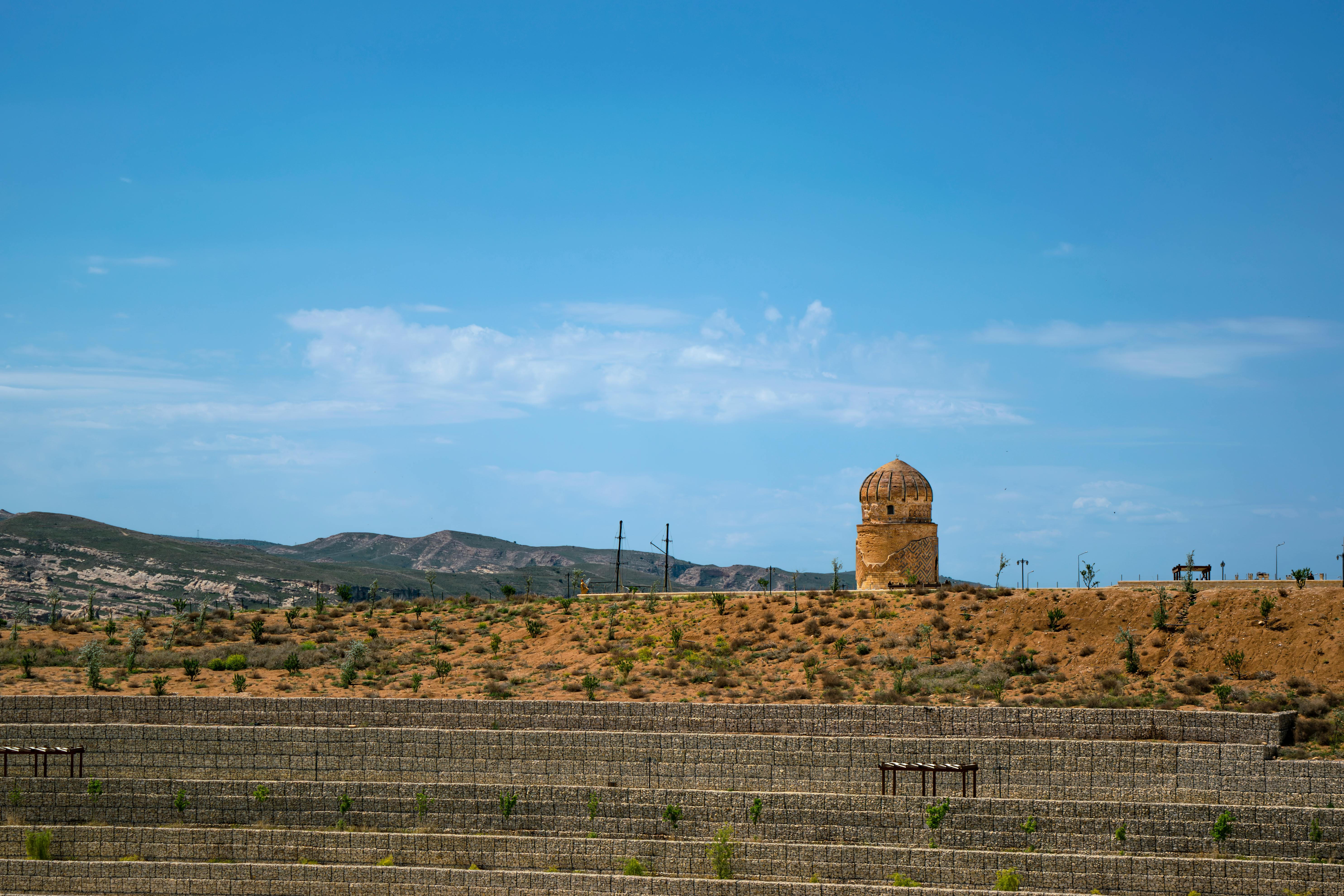 Rustic Mosque Minaret in Arid Landscape · Free Stock Photo