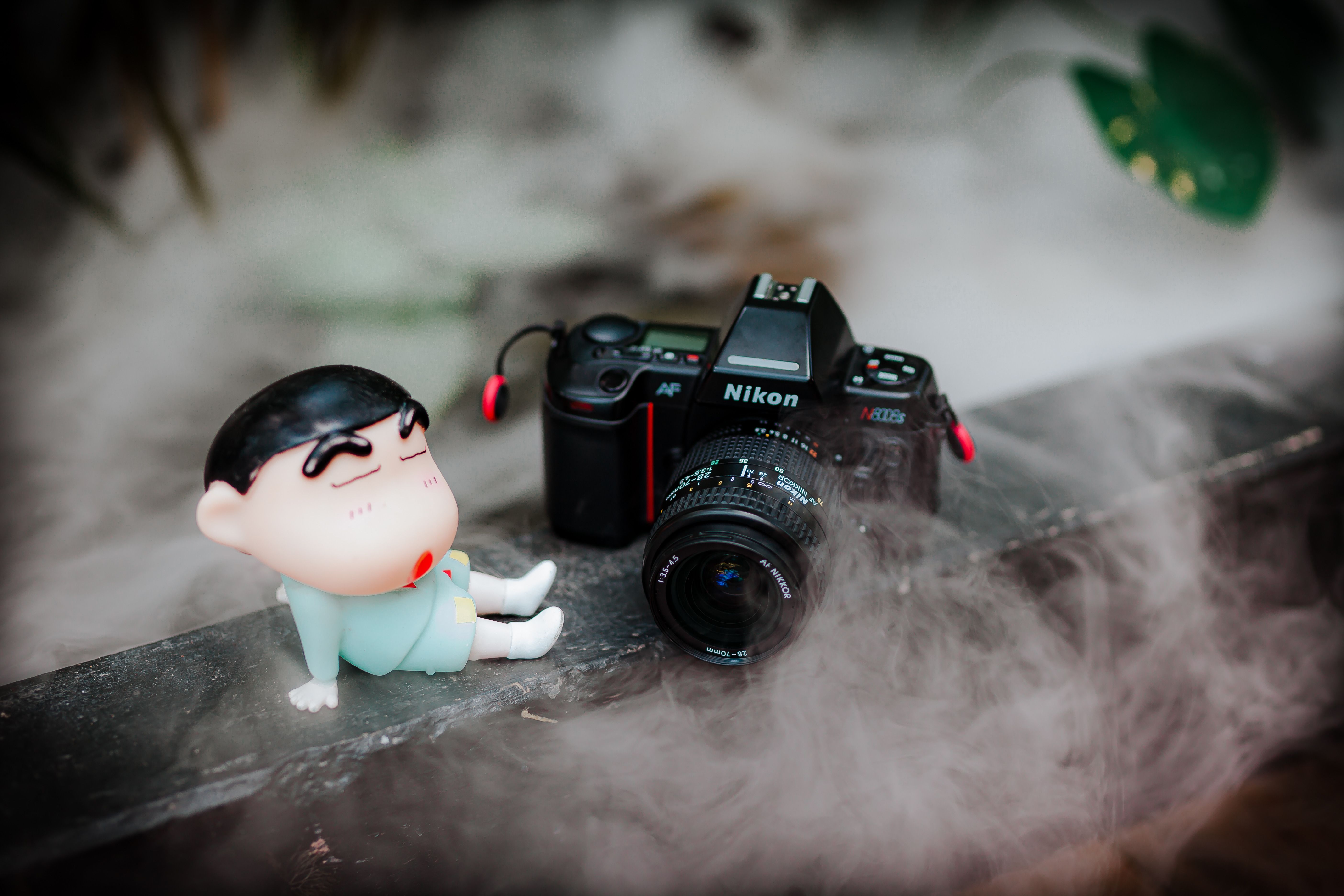 Vintage Camera with Cute Toy Figure in Soft Light · Free Stock Photo