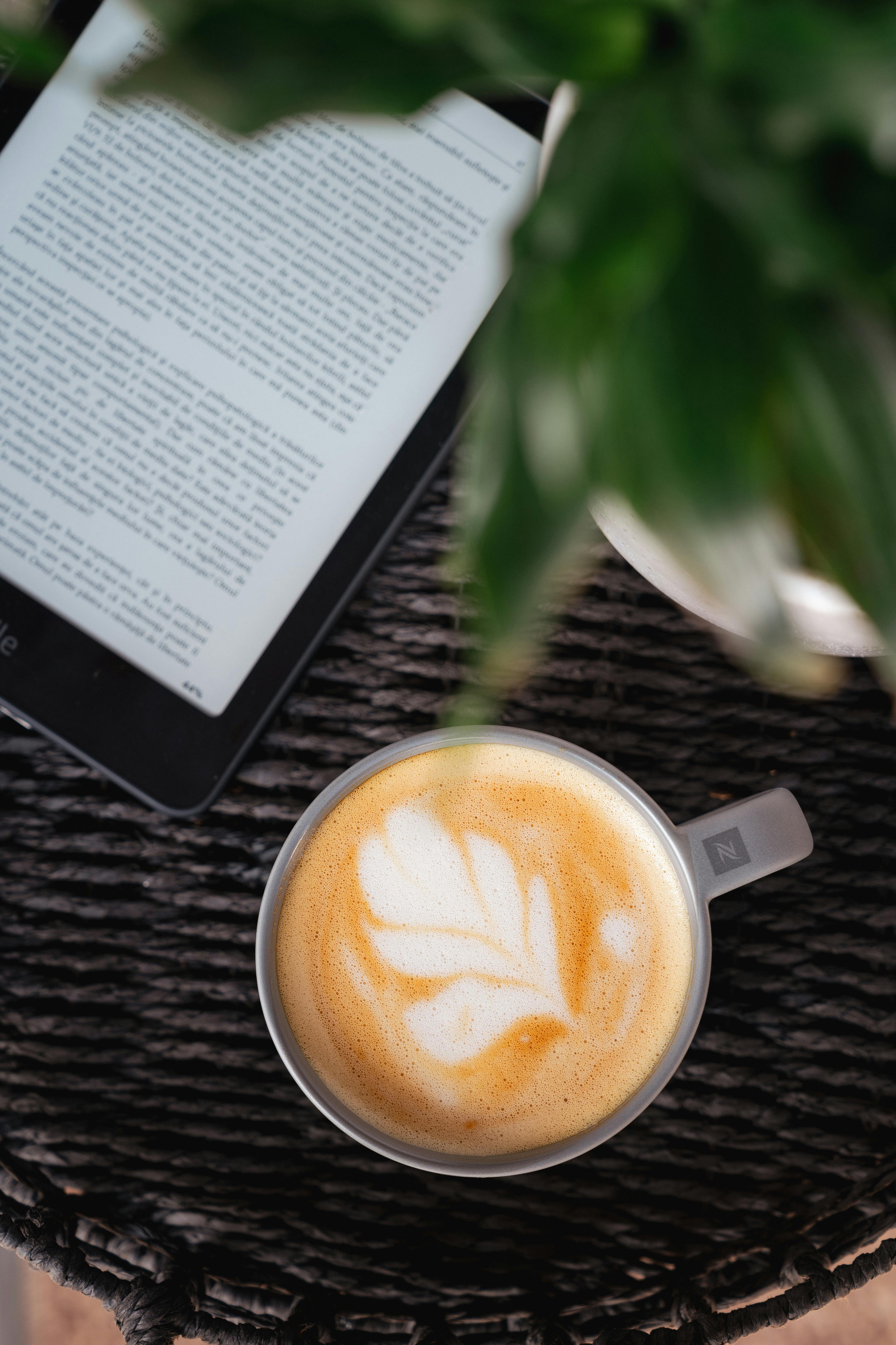 Cozy Coffee and eReader on Tabletop · Free Stock Photo