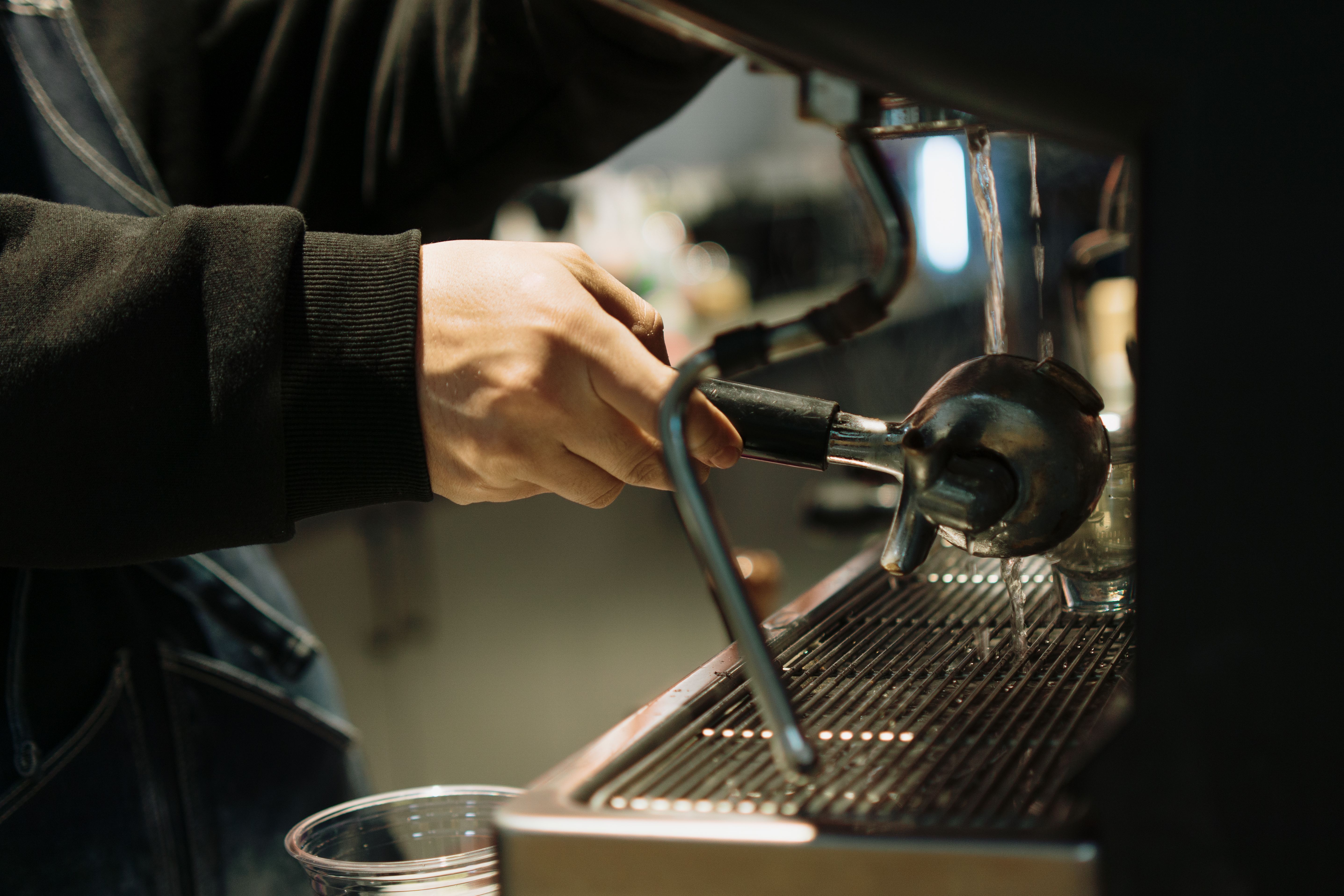 Close-up of Barista Preparing Espresso · Free Stock Photo