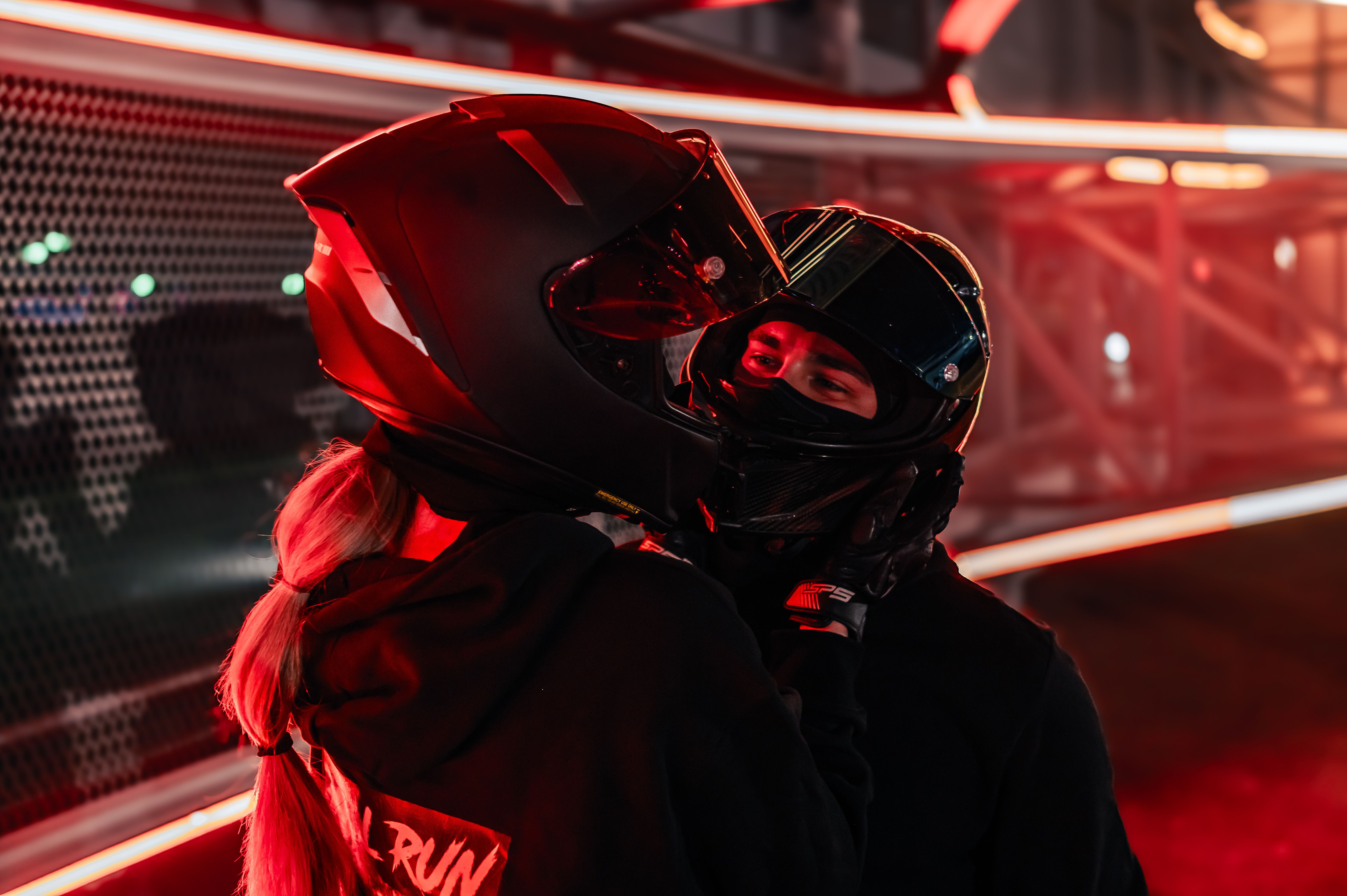 Couple Embracing with Motorcycle Helmets · Free Stock Photo