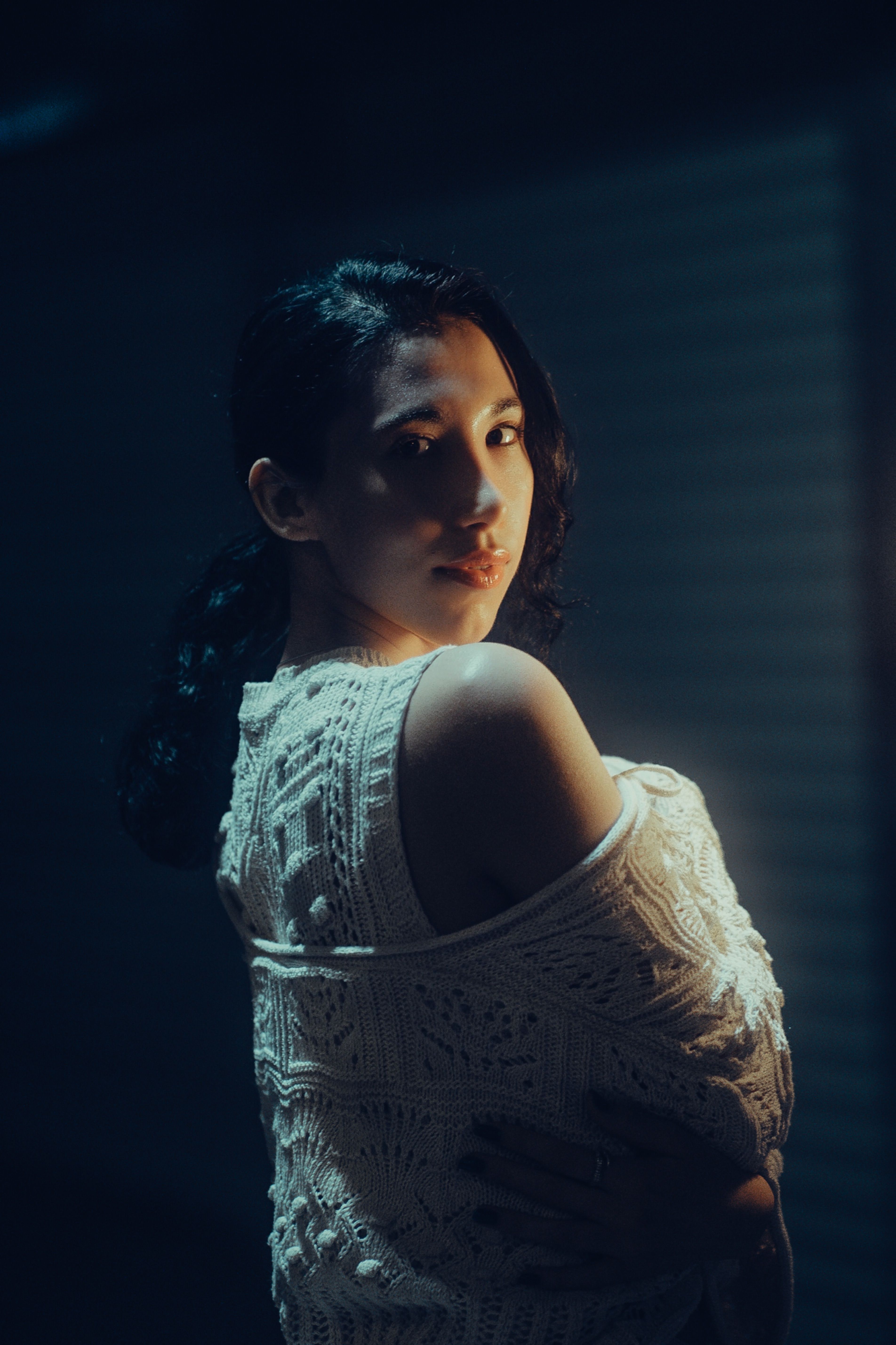 Moody Portrait of Woman in Dim Lighting · Free Stock Photo