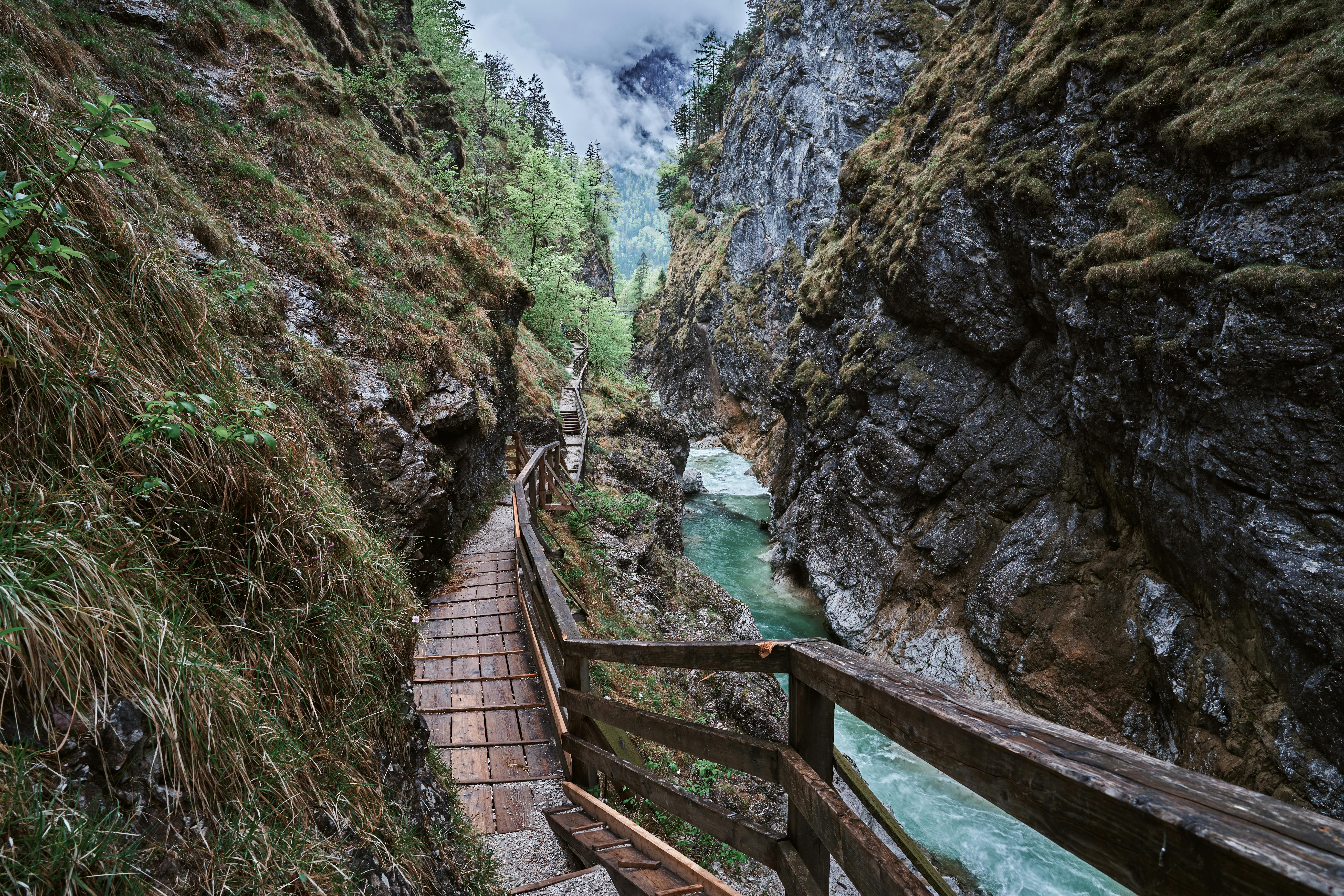 Scenic Wooden Pathway Through Alpine Gorge · Free Stock Photo