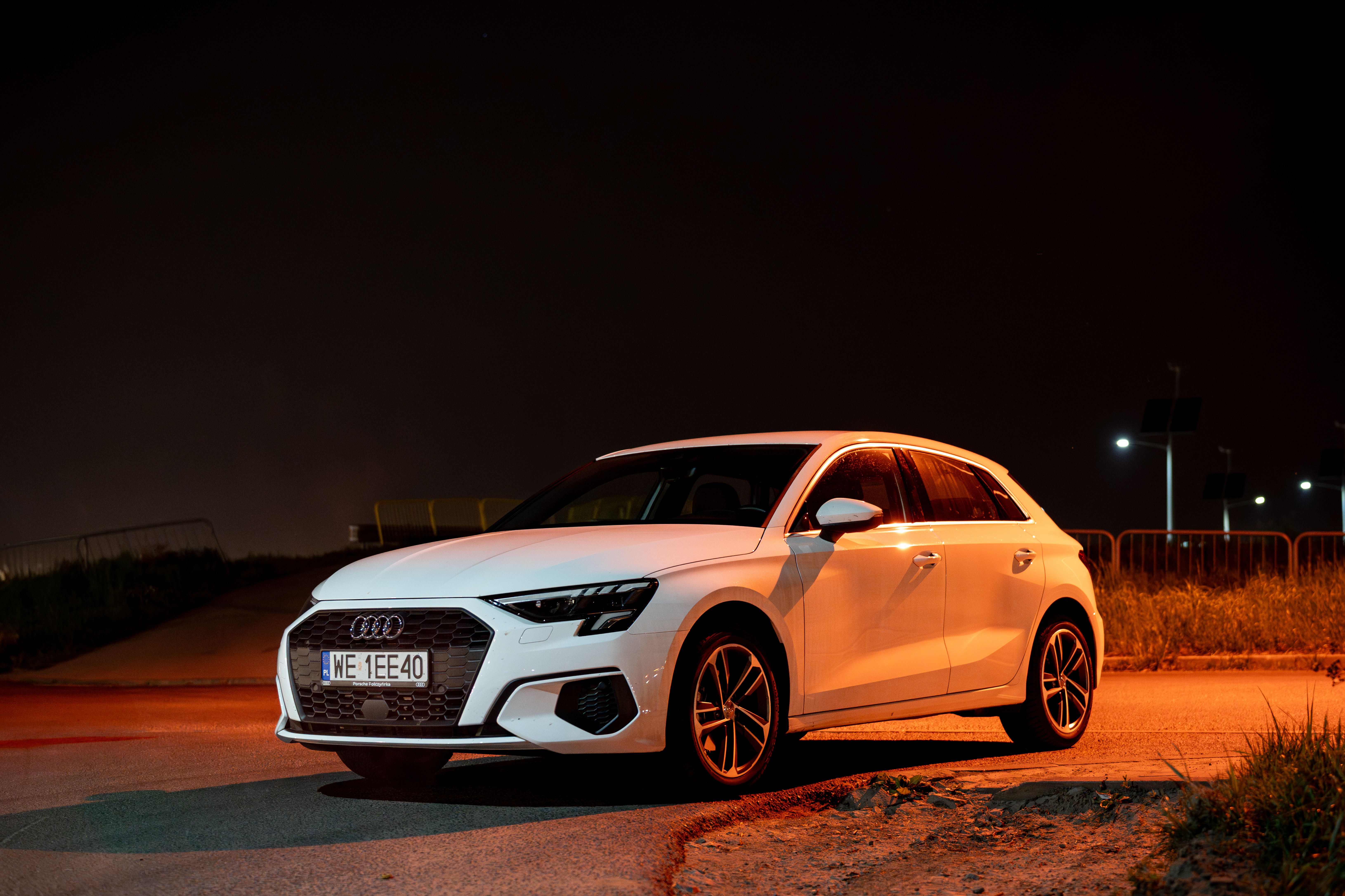 White Car at Night on Urban Street in Kokotów · Free Stock Photo