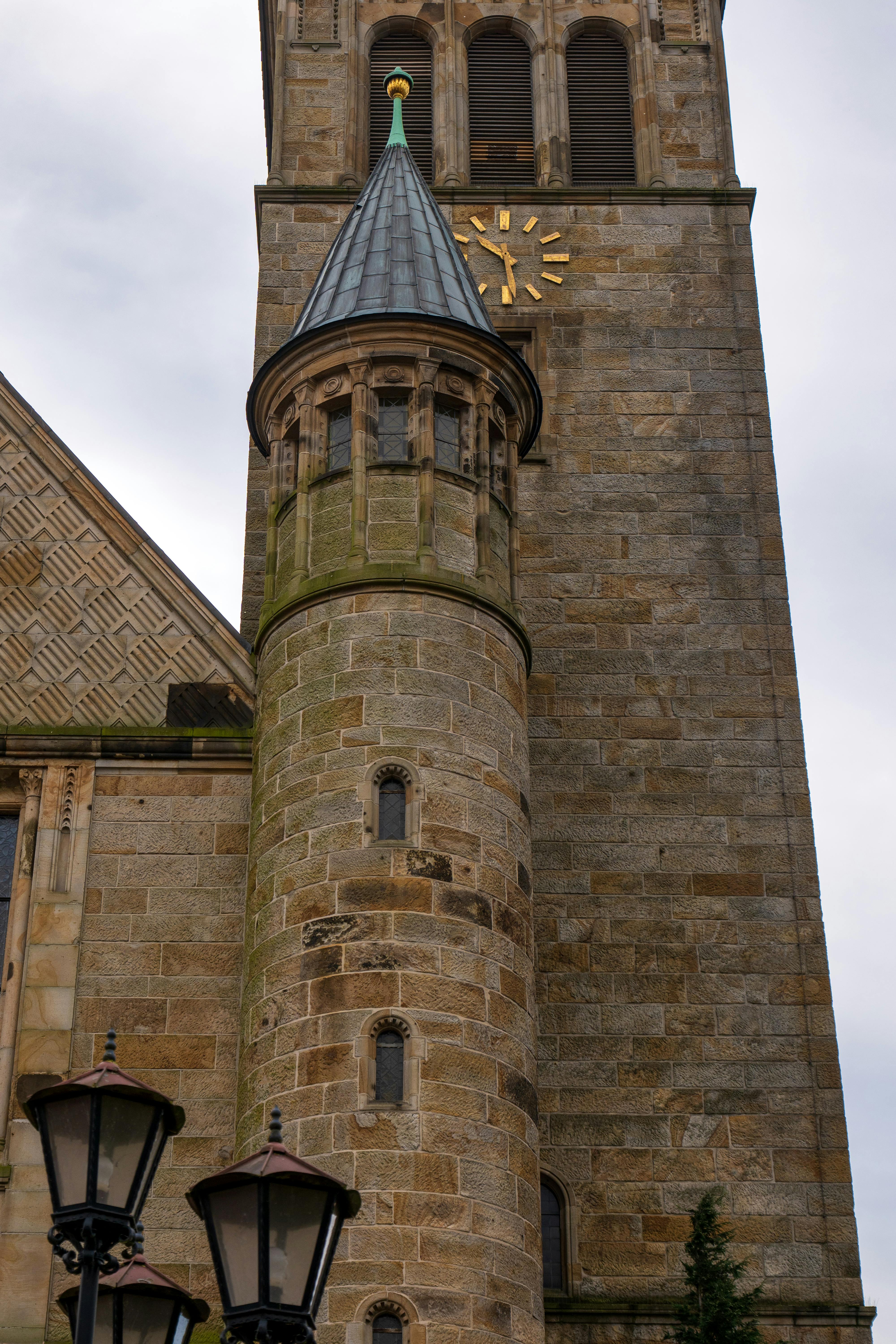 Gothic Stone Tower with Clock and Turrets · Free Stock Photo