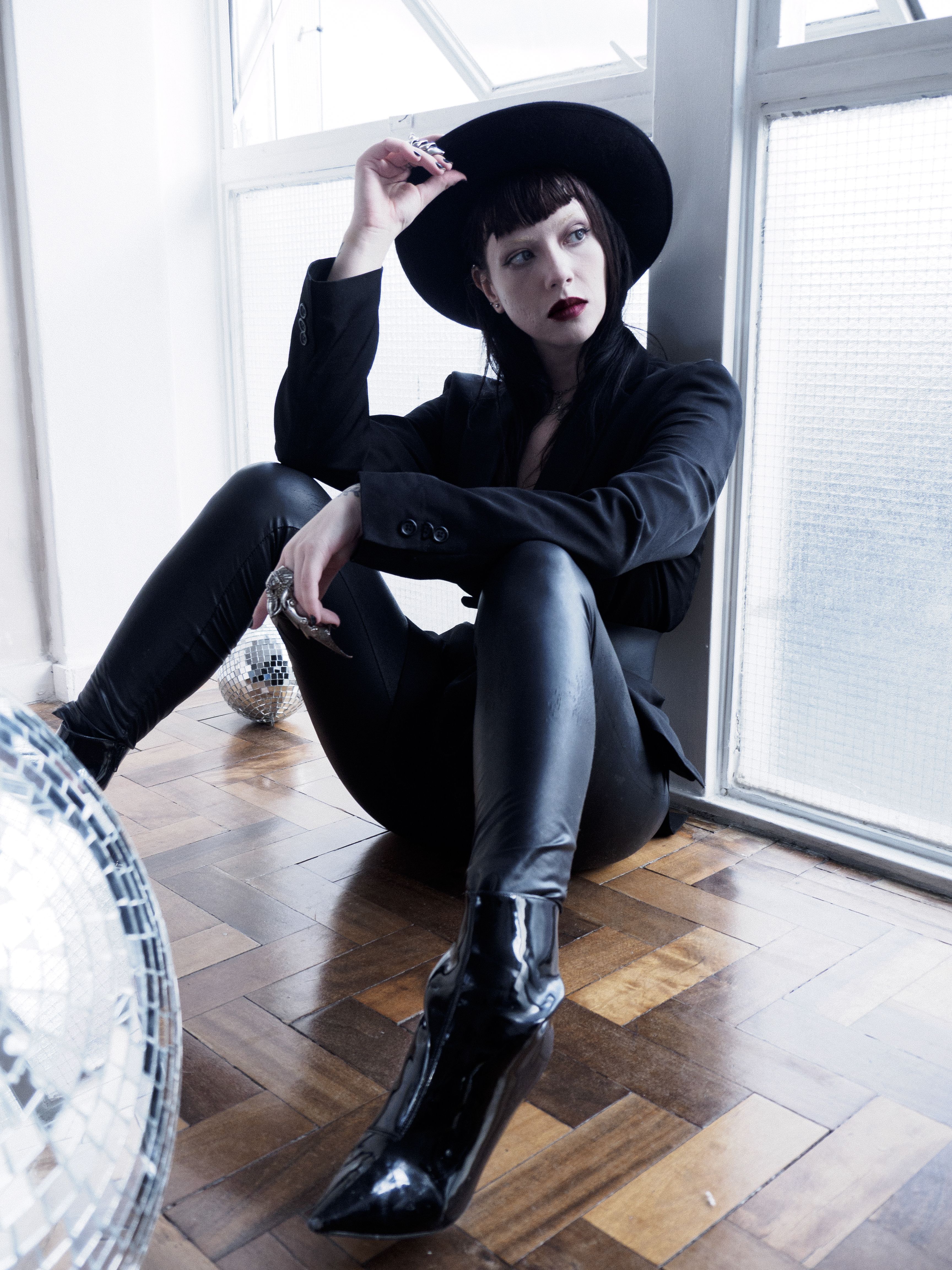 Edgy Fashion Portrait with Disco Ball Ambiance · Free Stock Photo