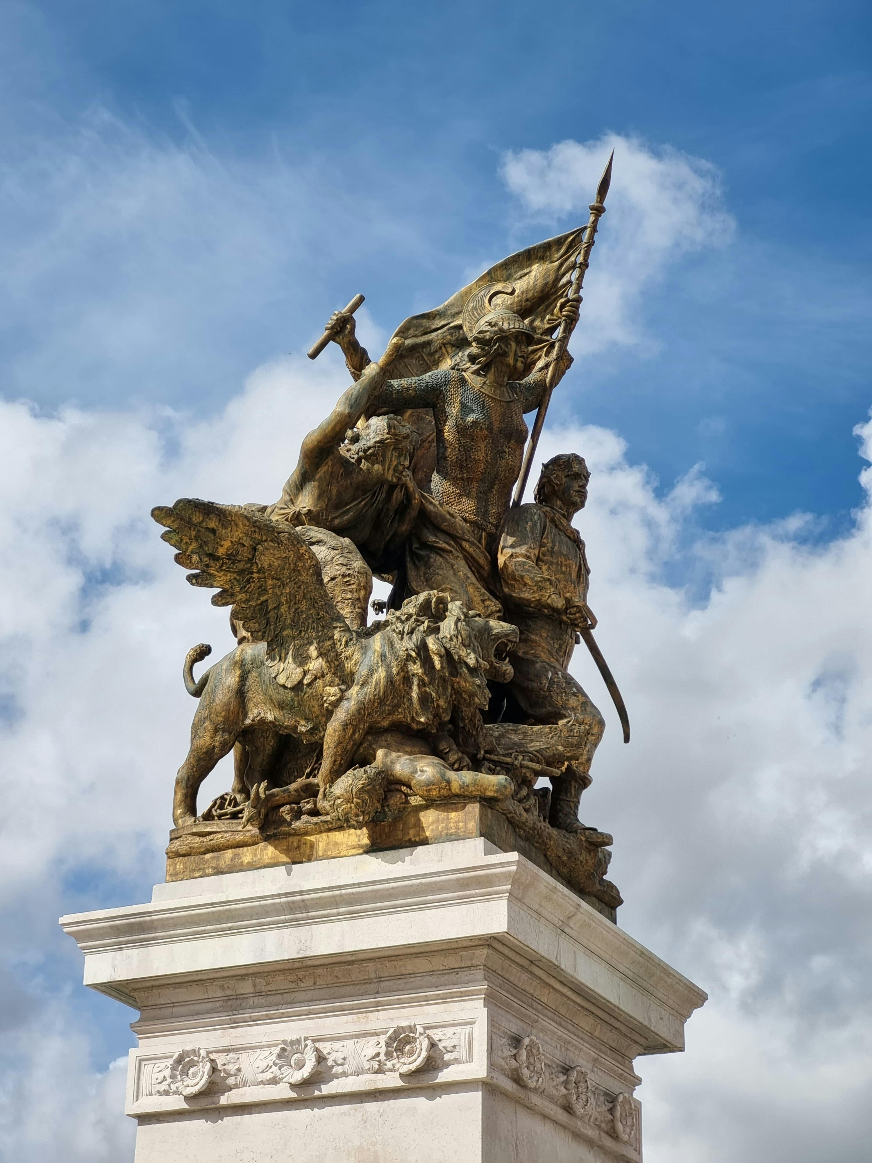 Dramatic Statue Against a Clear Blue Sky · Free Stock Photo