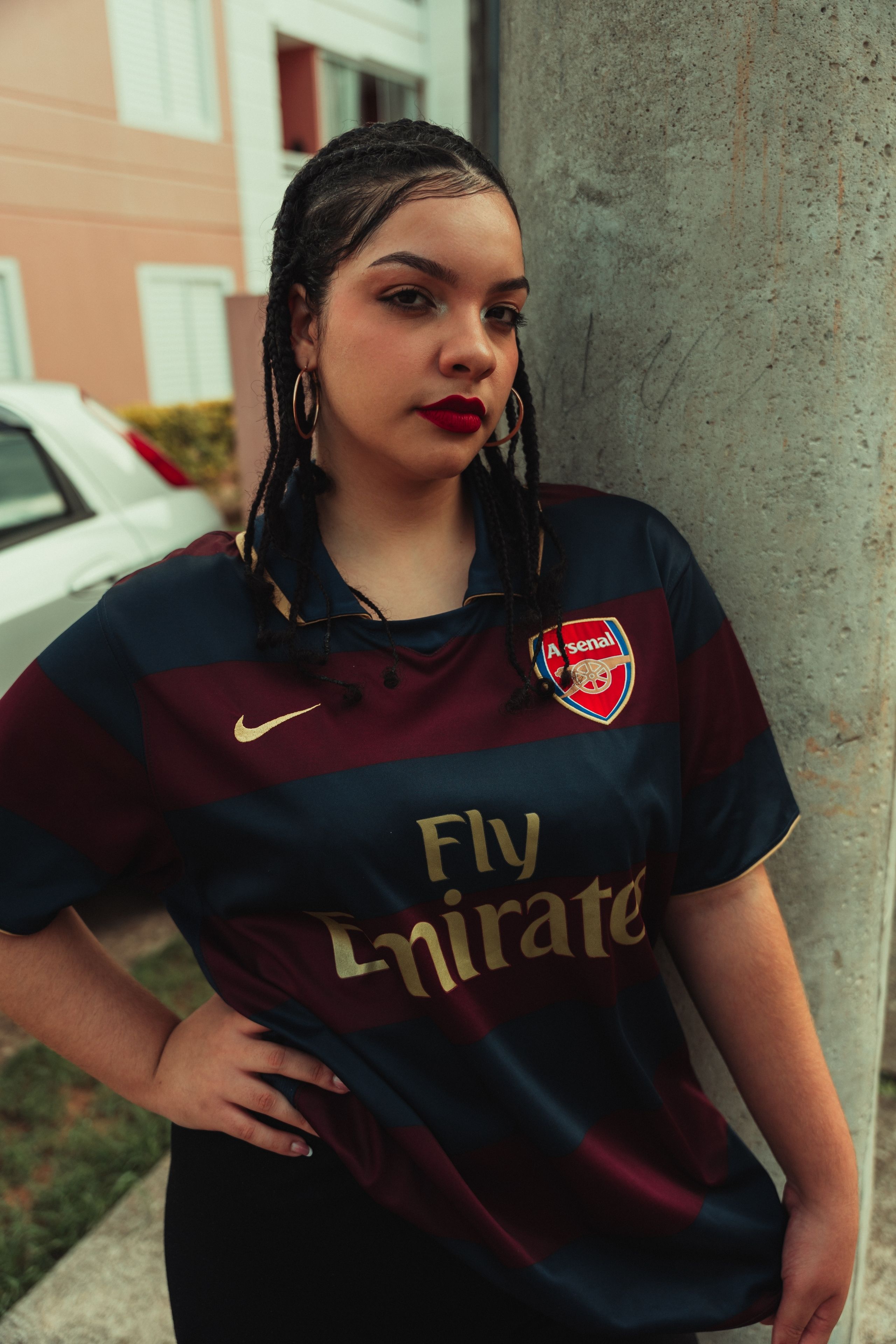 Young Woman Wearing Soccer Jersey Outdoors · Free Stock Photo