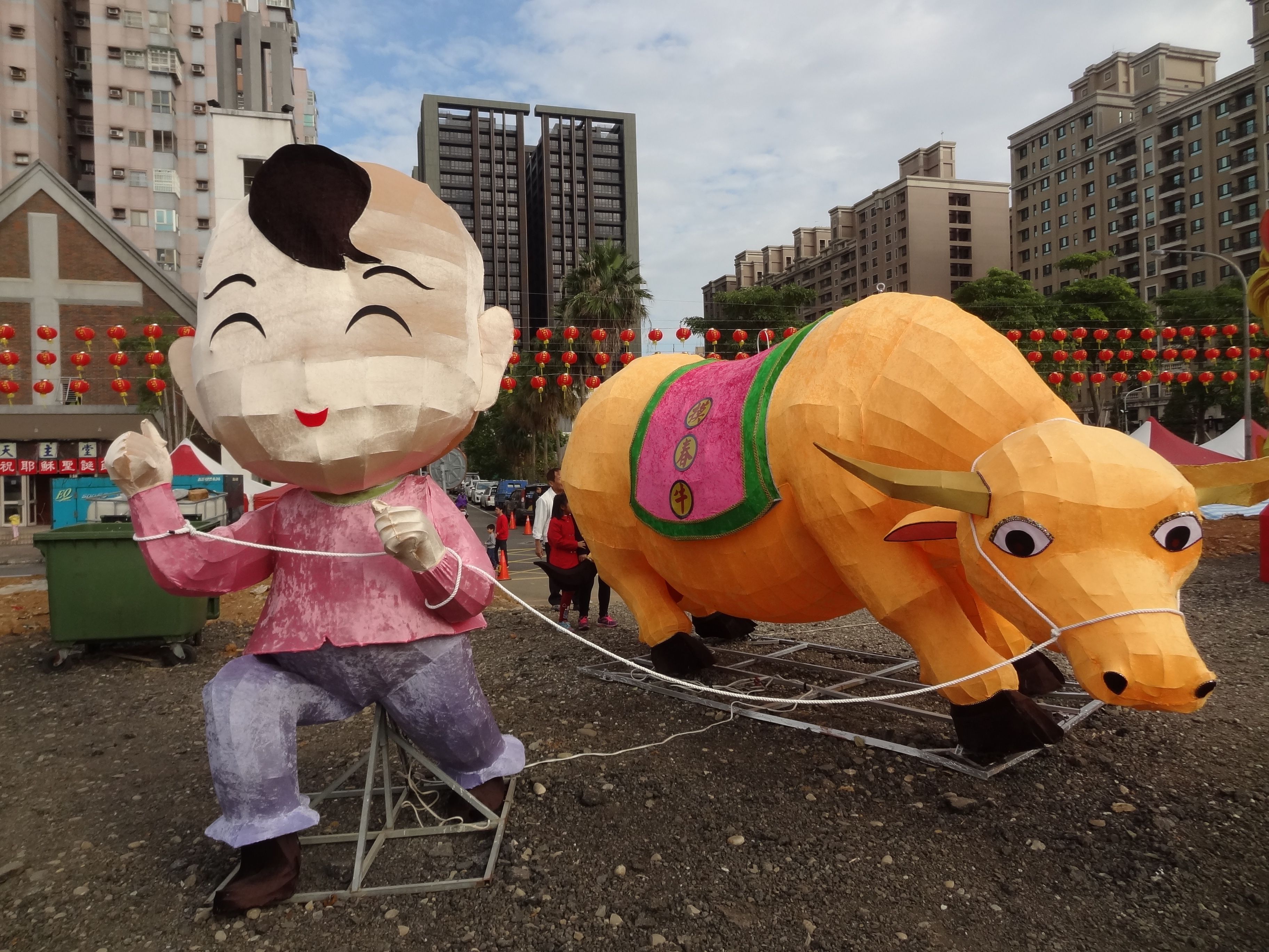 Large Paper Sculpture of Child and Oxen at Festival · Free Stock Photo