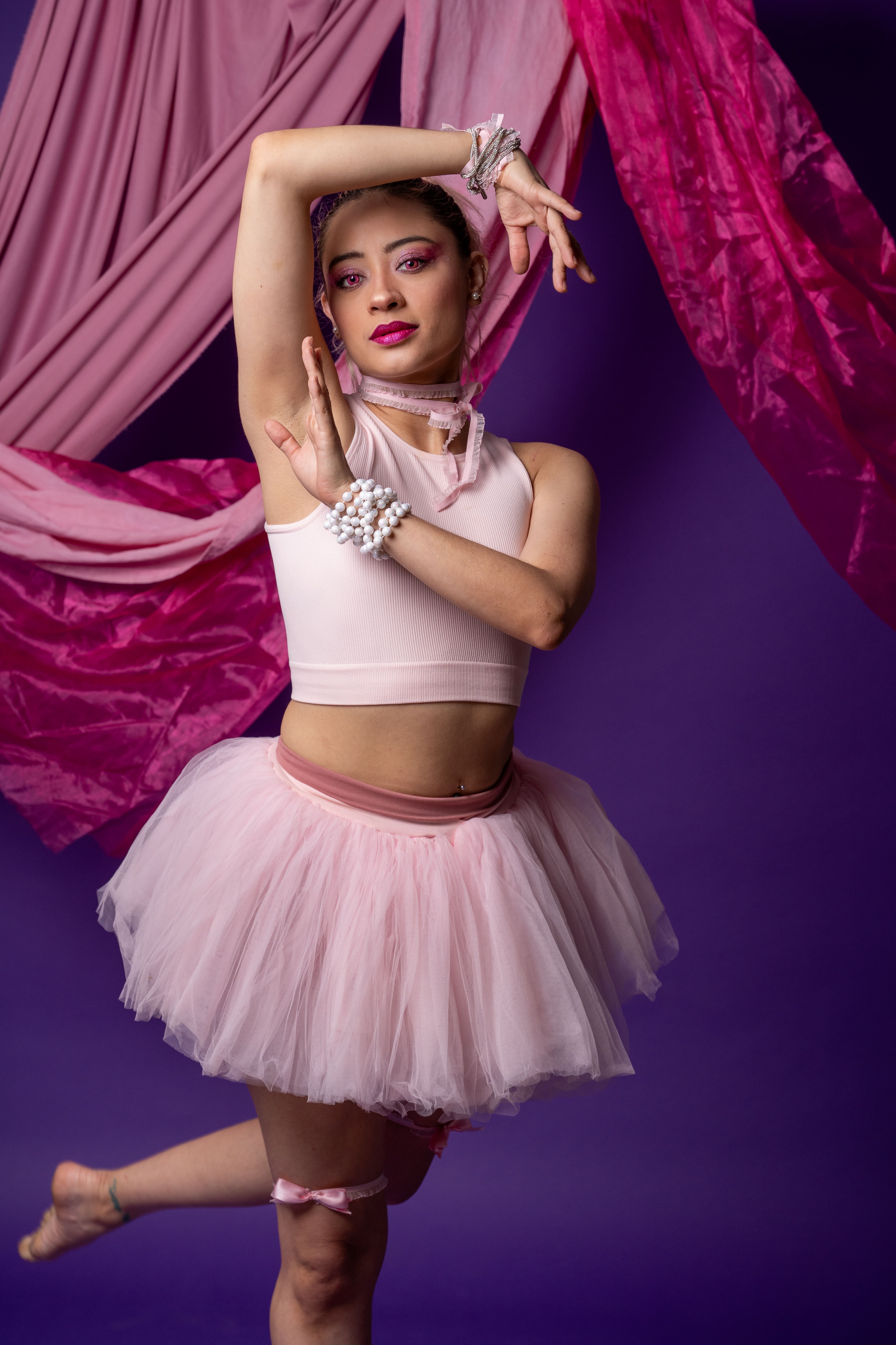 Elegant Latina Dancer in Pink Tutu Posing Gracefully · Free Stock Photo