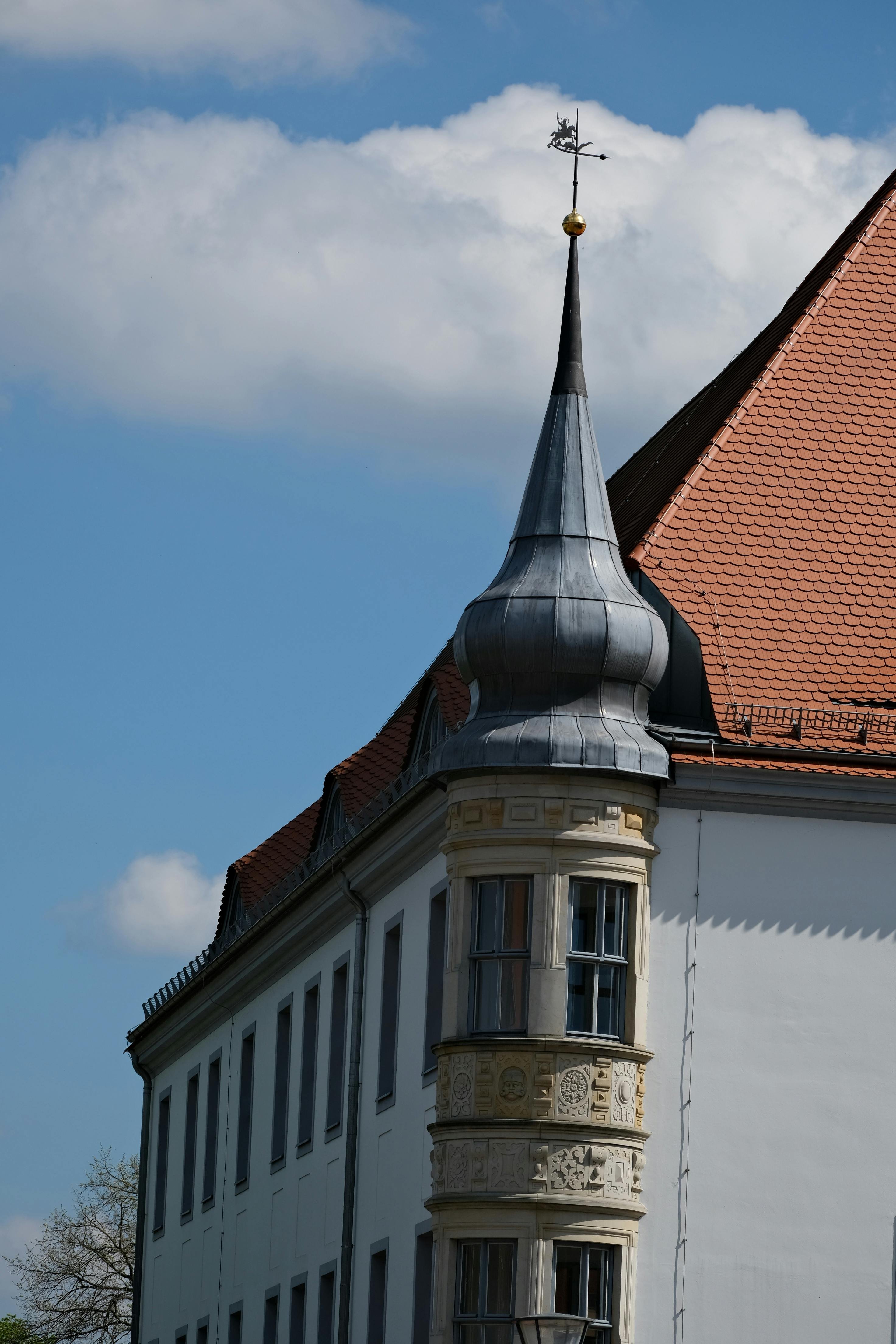 Charming Historical Building with Unique Turret · Free Stock Photo