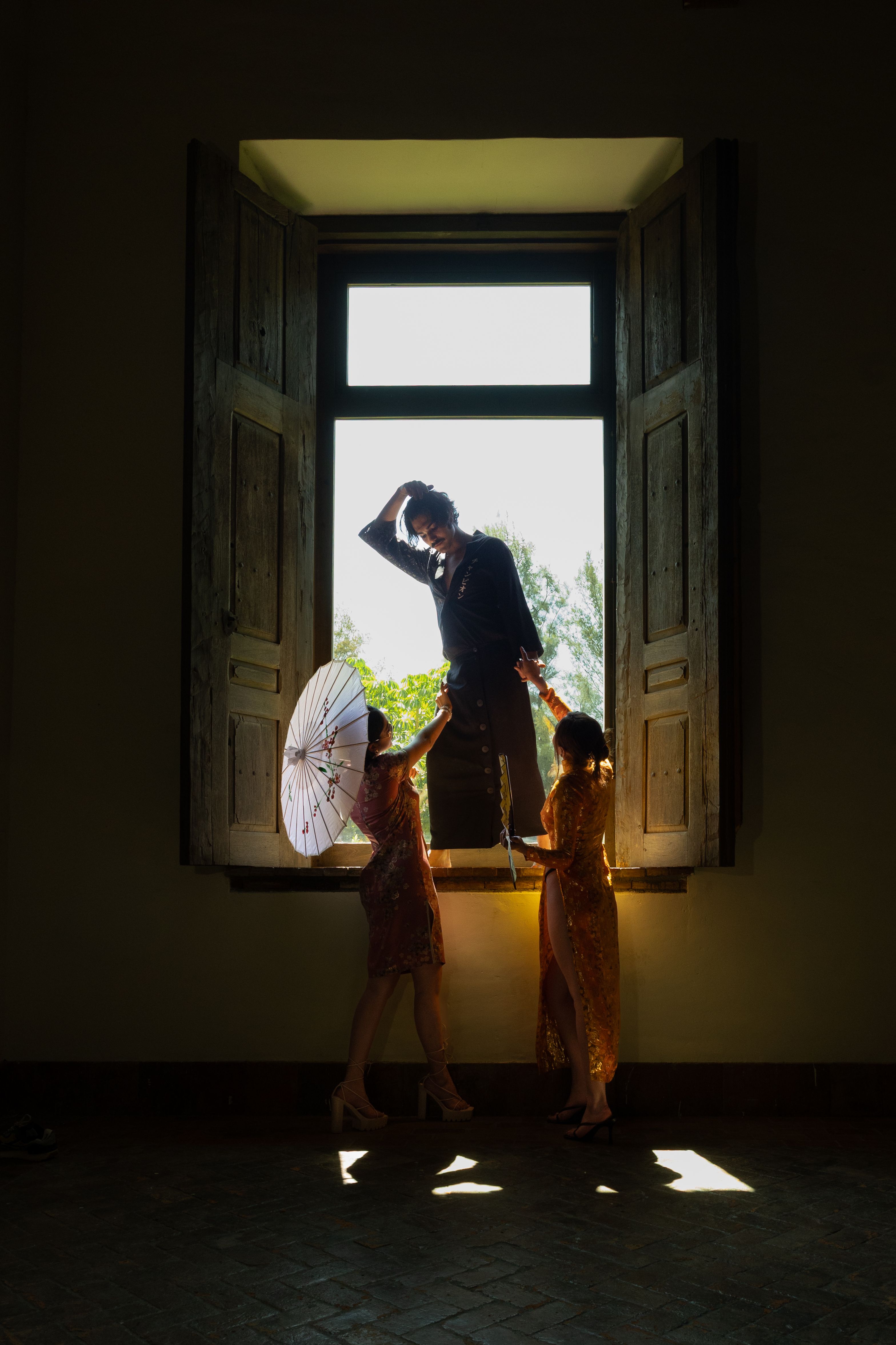 Silhouetted Figures in Dramatic Window Light · Free Stock Photo