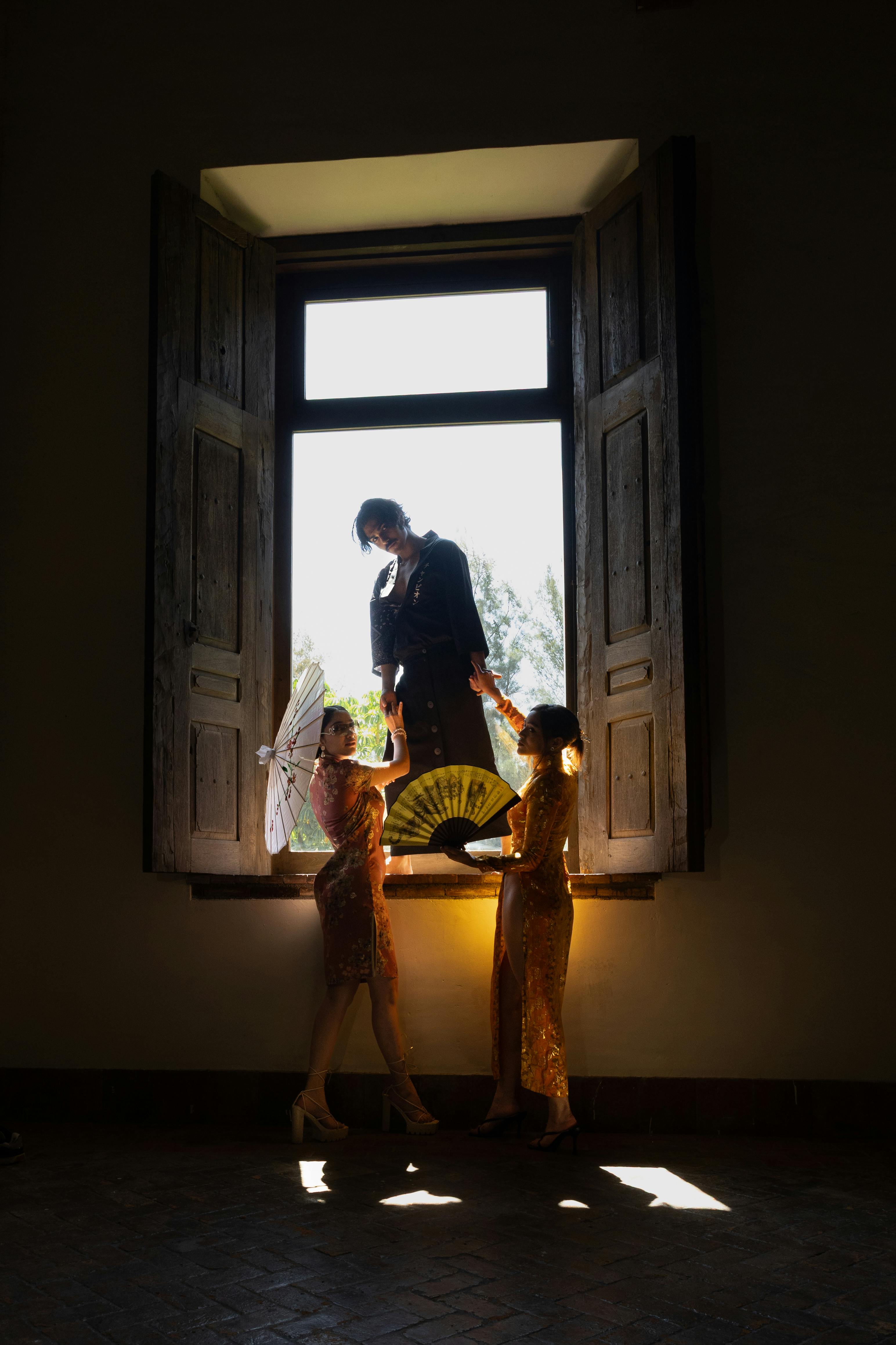 Artistic Portrait of People in Window Frame · Free Stock Photo