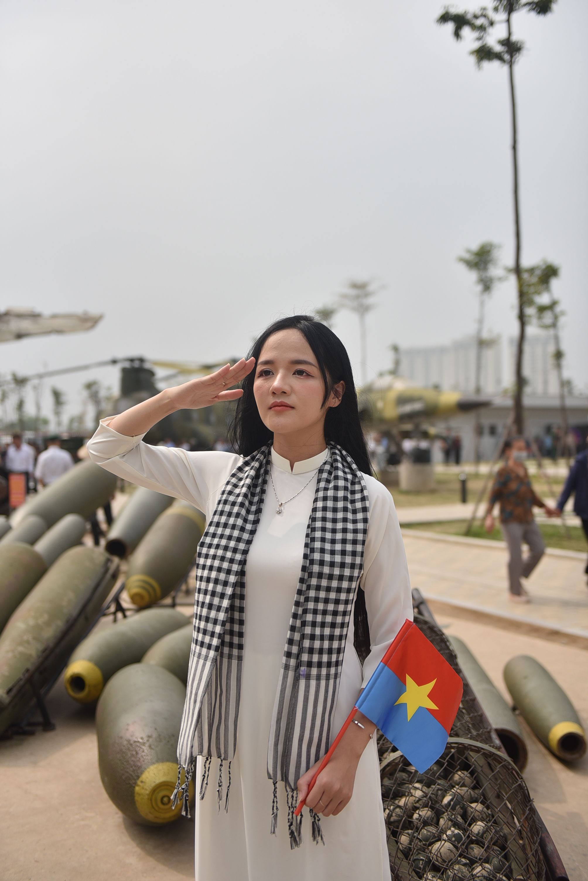 Young Woman Saluting with Flag Outdoors · Free Stock Photo