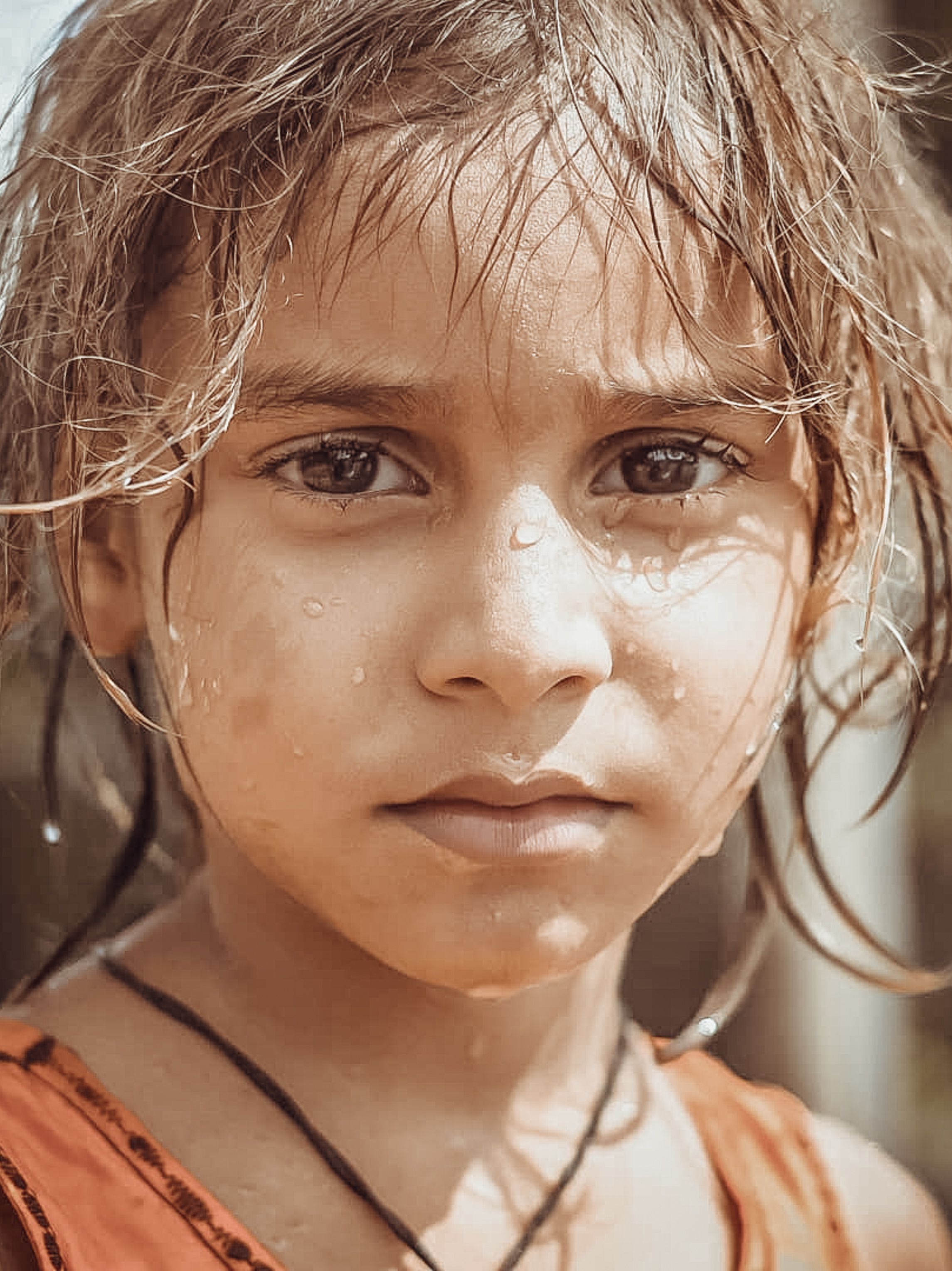 Portrait of Child with Water Droplets Outdoors · Free Stock Photo