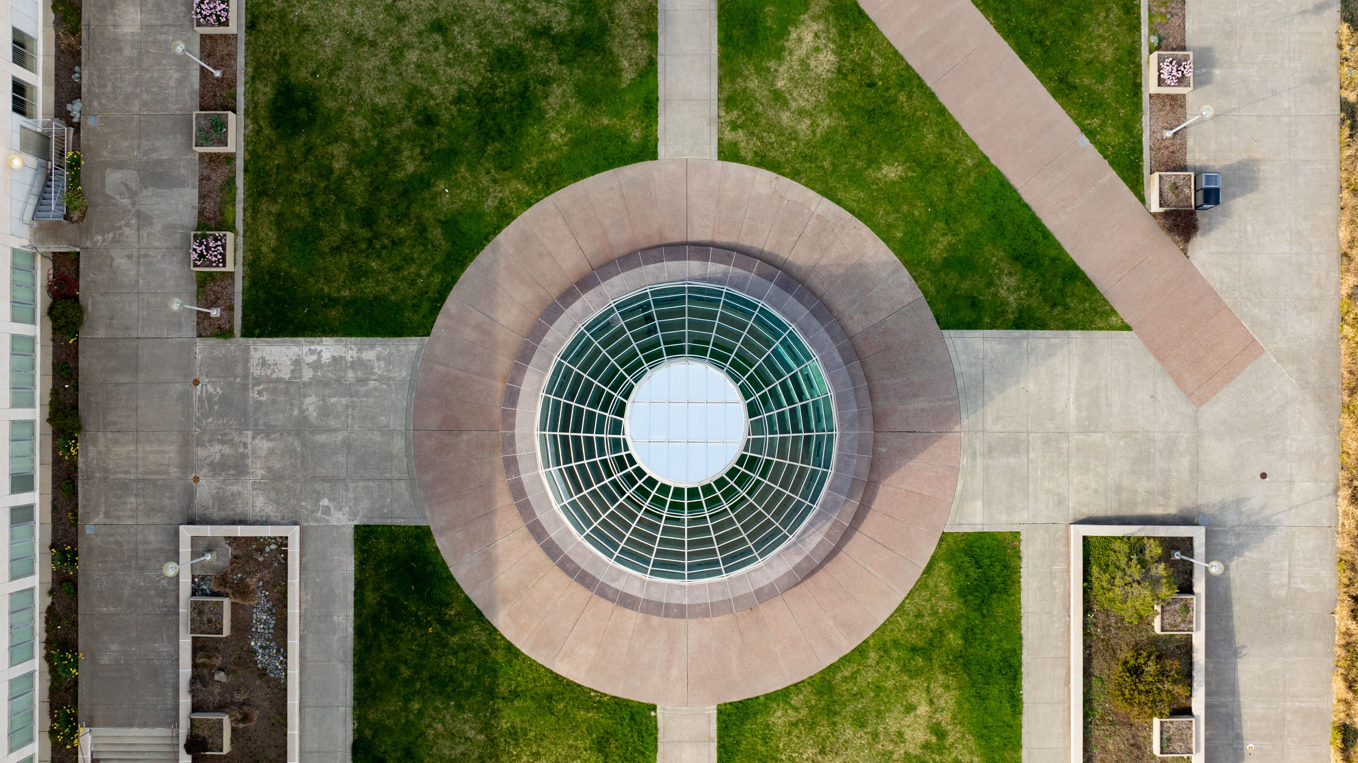 Aerial View of Circular Glass Structure on Campus · Free Stock Photo