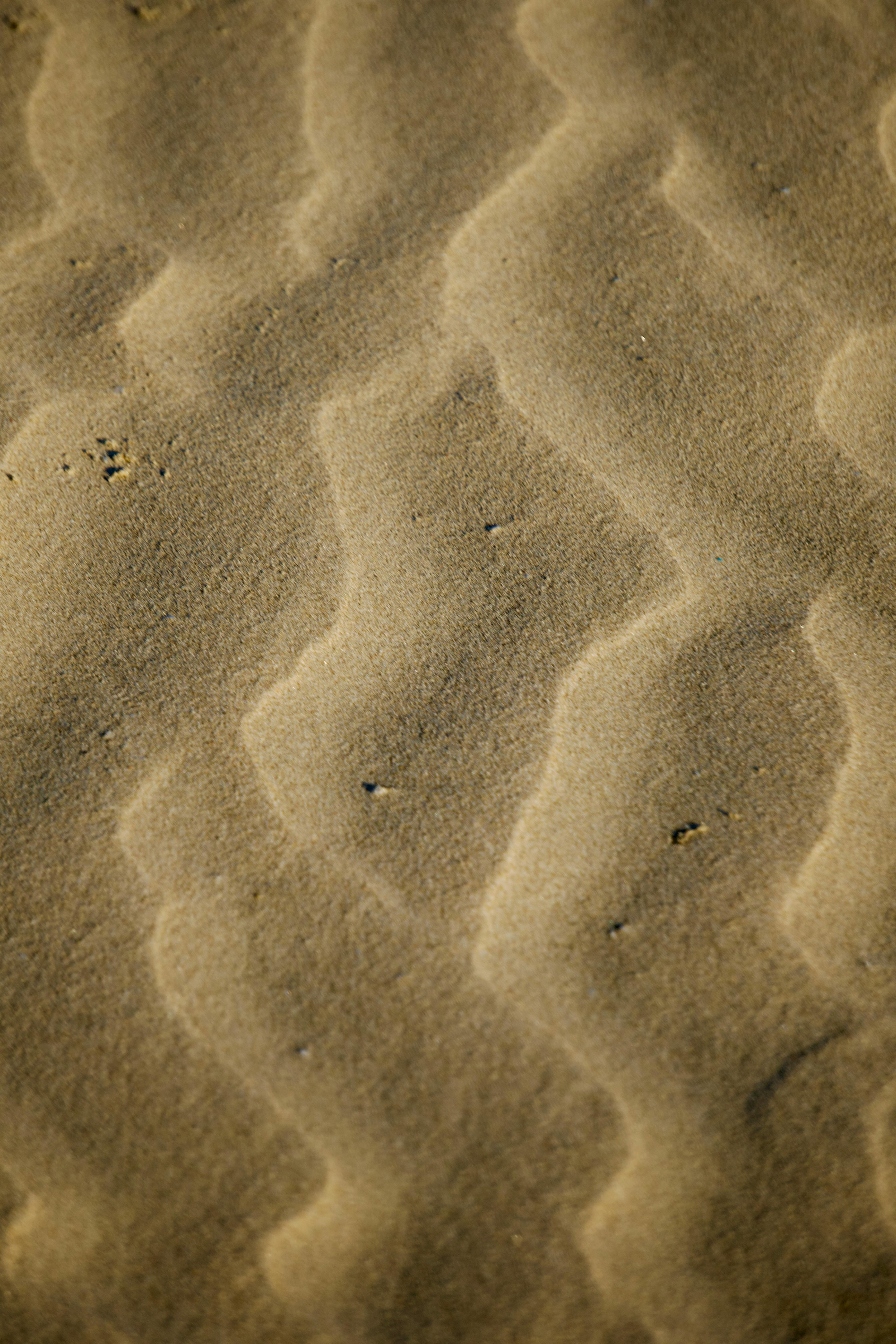Close-up of Wavy Sand Patterns on Beach · Free Stock Photo