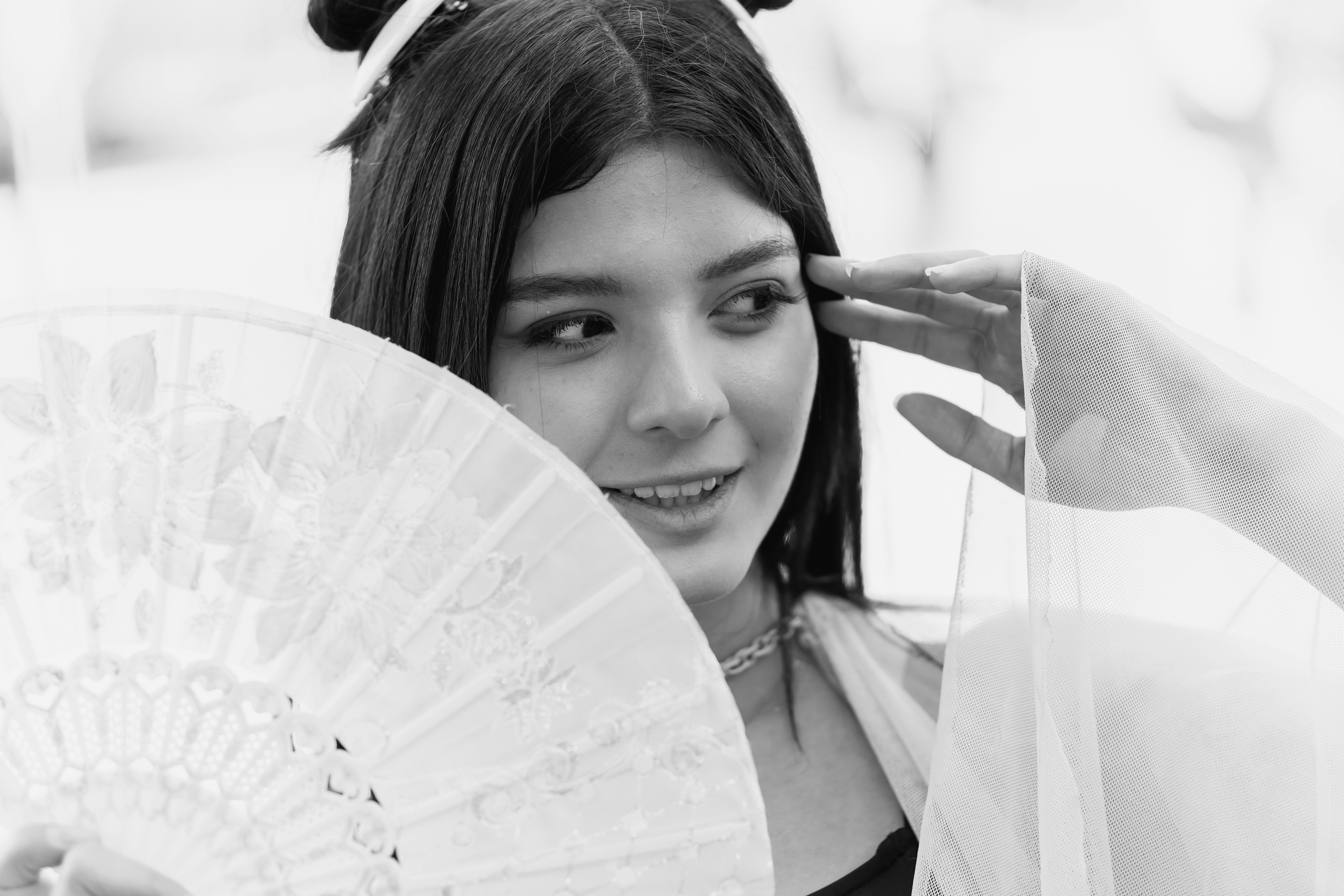 Elegant Portrait of Woman with Decorative Fan · Free Stock Photo