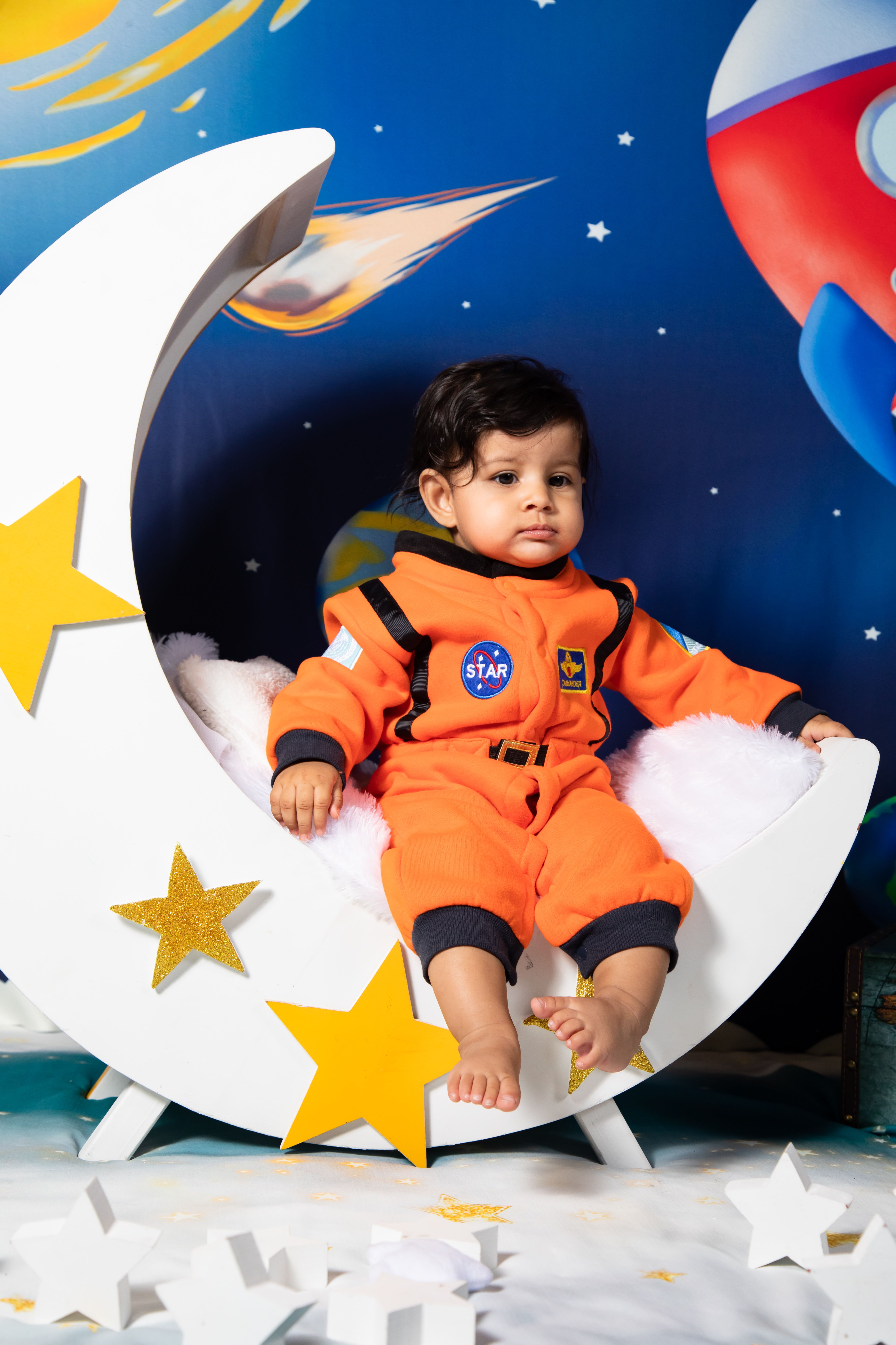 Adorable Baby Astronaut in Space-Themed Setup · Free Stock Photo