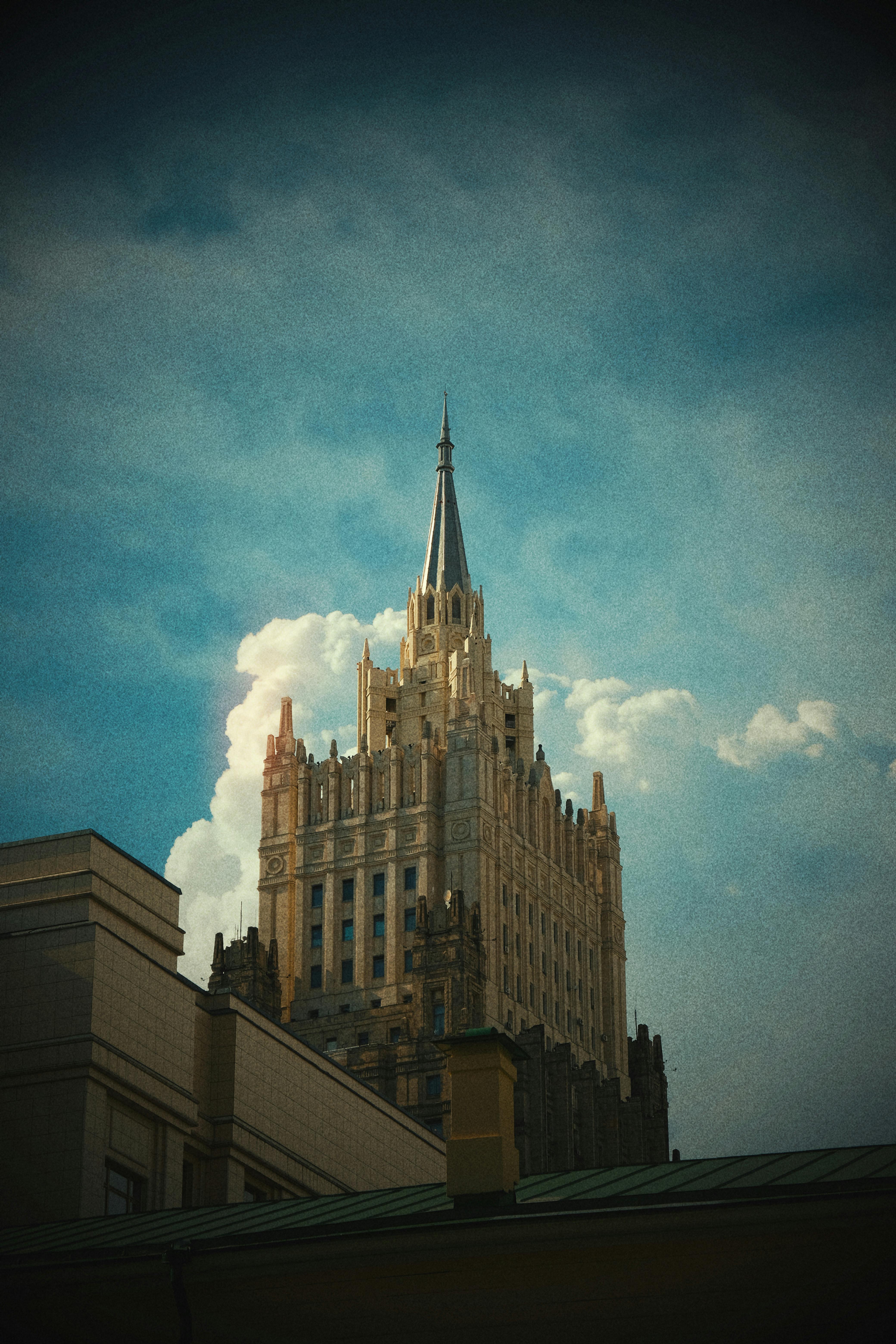Tall Gothic Building Against Clear Blue Sky · Free Stock Photo