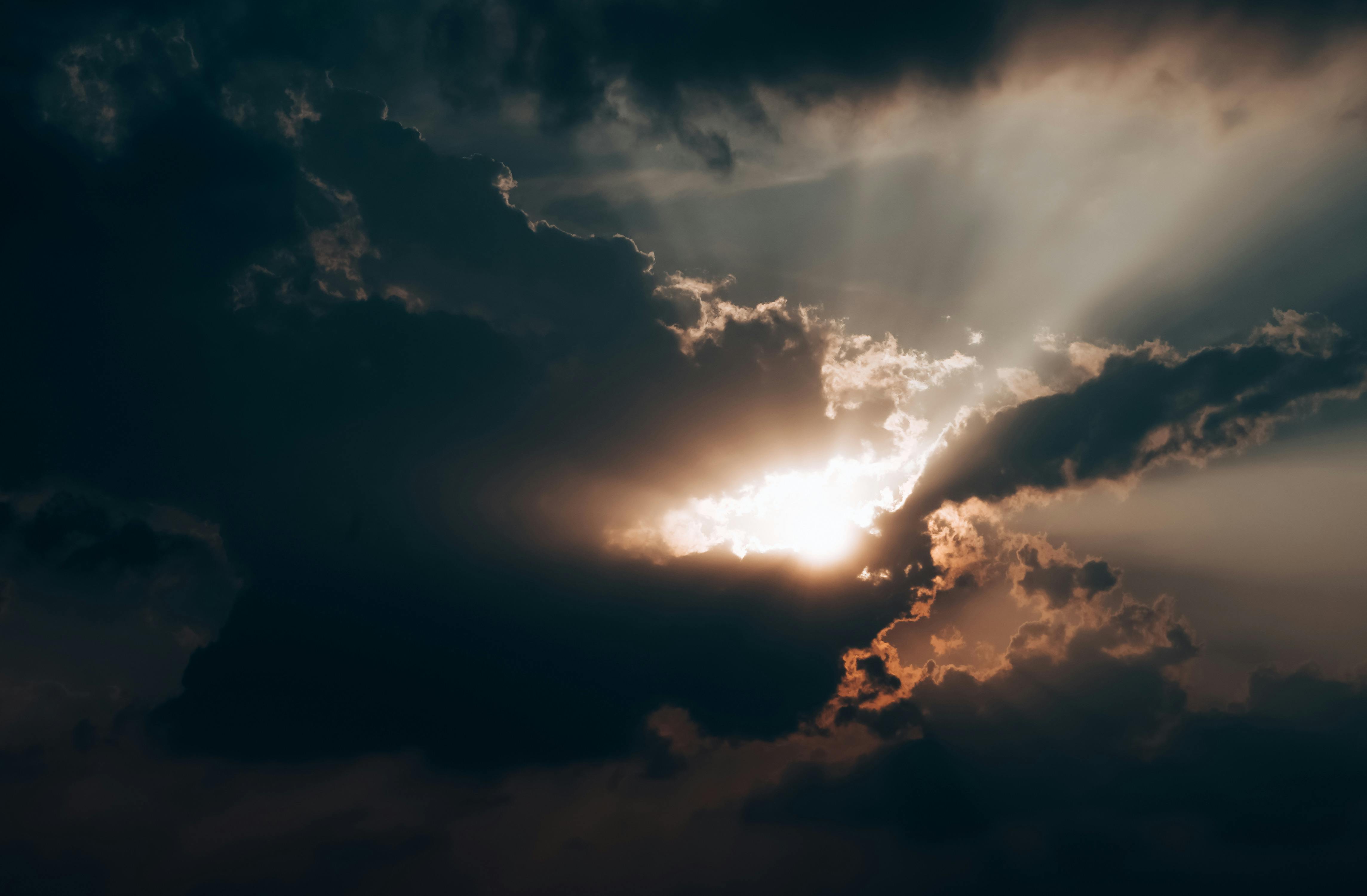 Dramatic Sunlight Breaking Through Clouds · Free Stock Photo