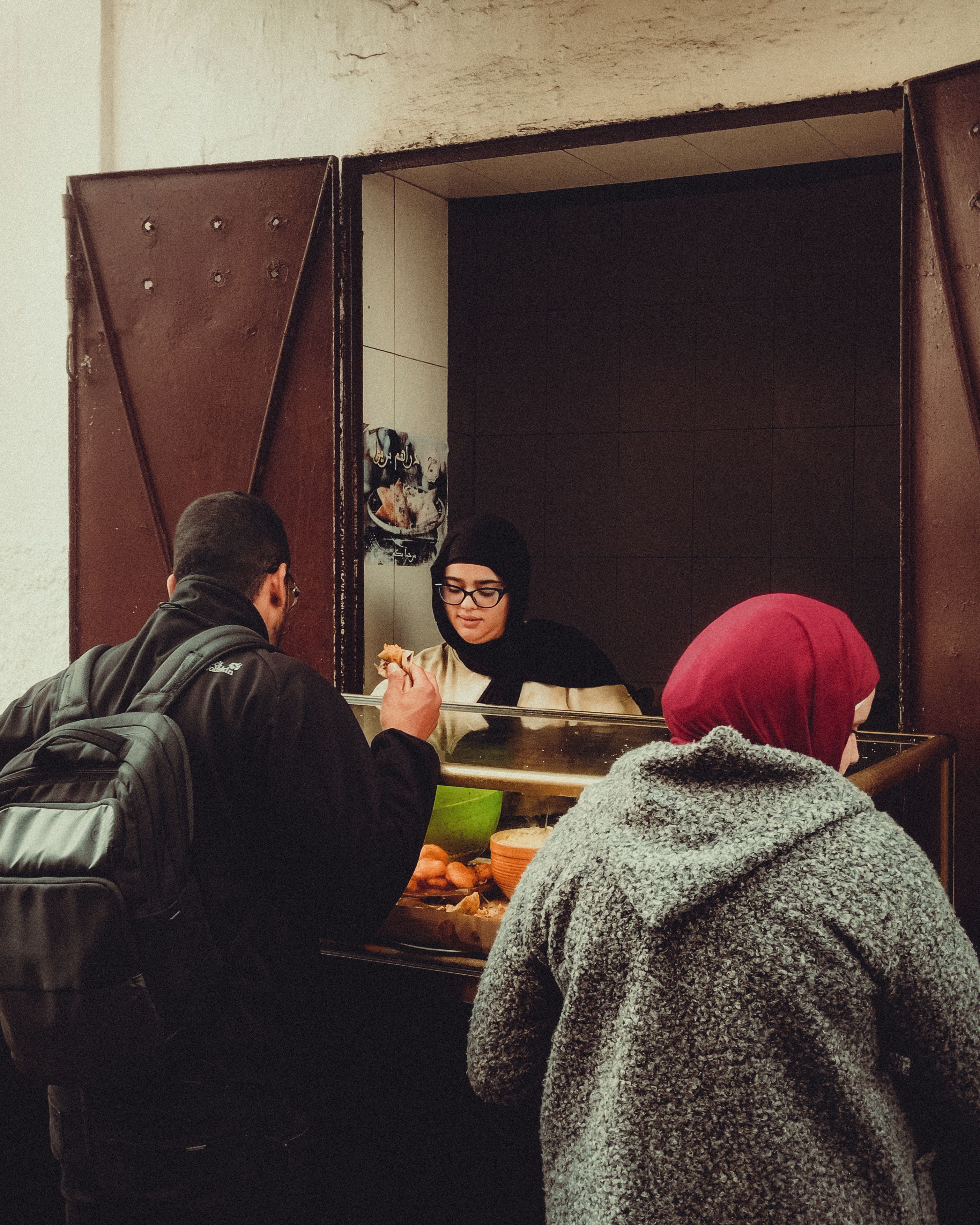 Street Food Vendor Selling Snacks in the Market · Free Stock Photo