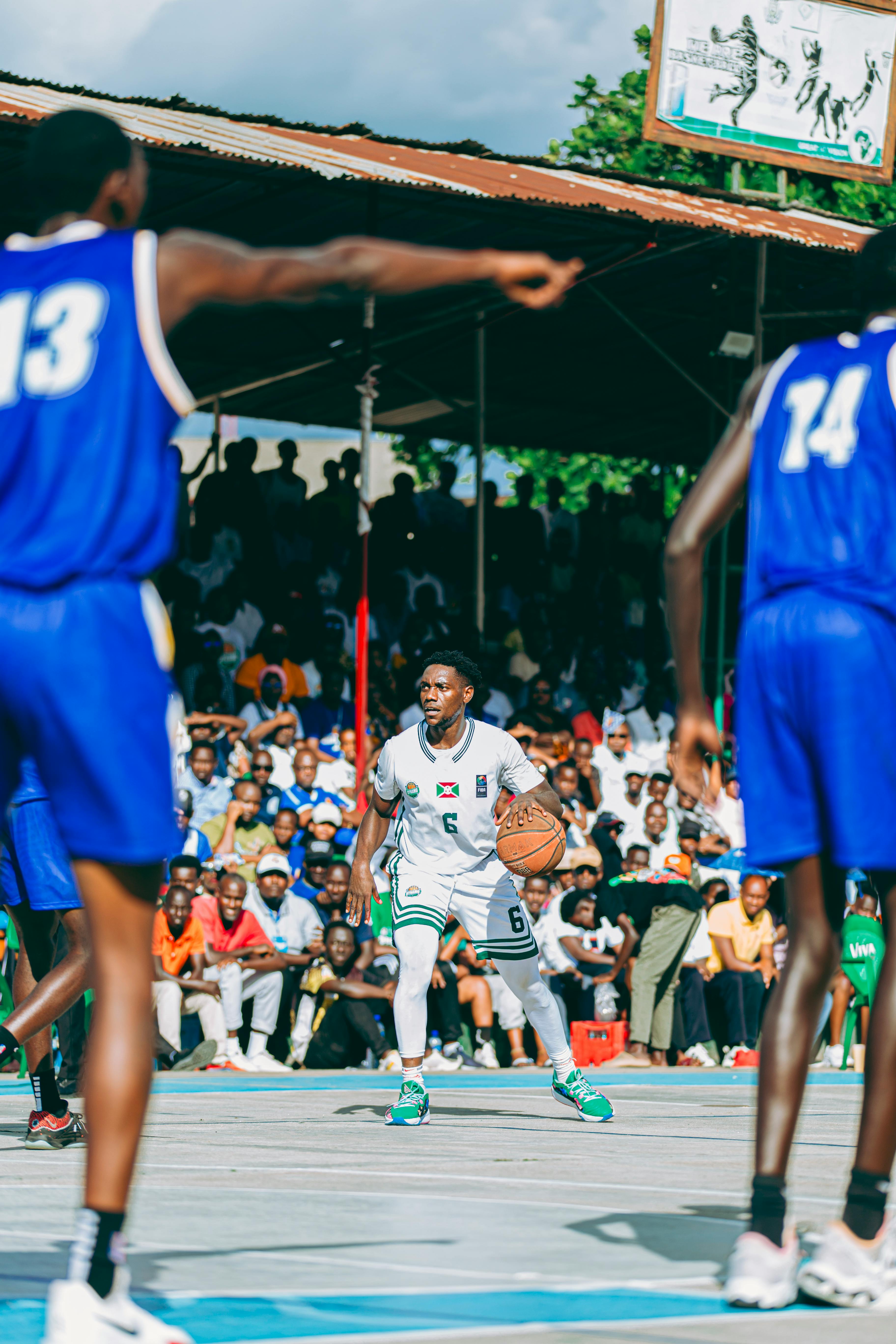Outdoor Basketball Game with Enthusiastic Crowd · Free Stock Photo