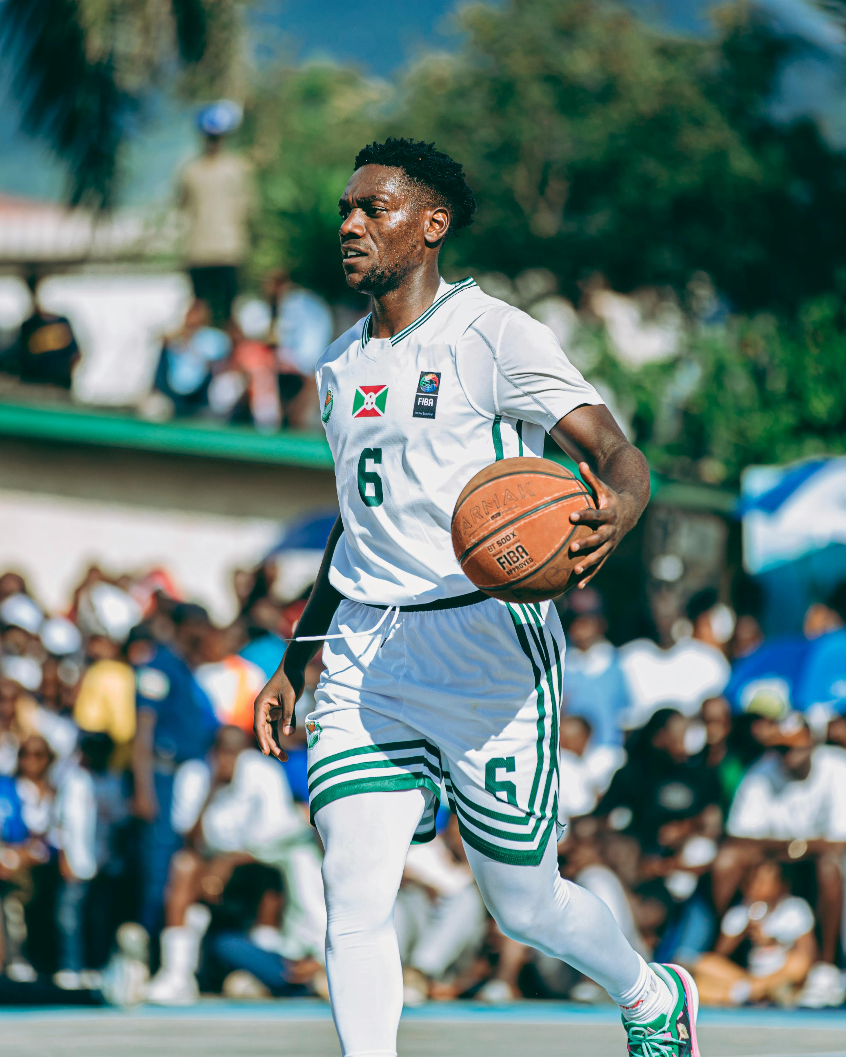 Outdoor Basketball Player Dribbling Ball · Free Stock Photo