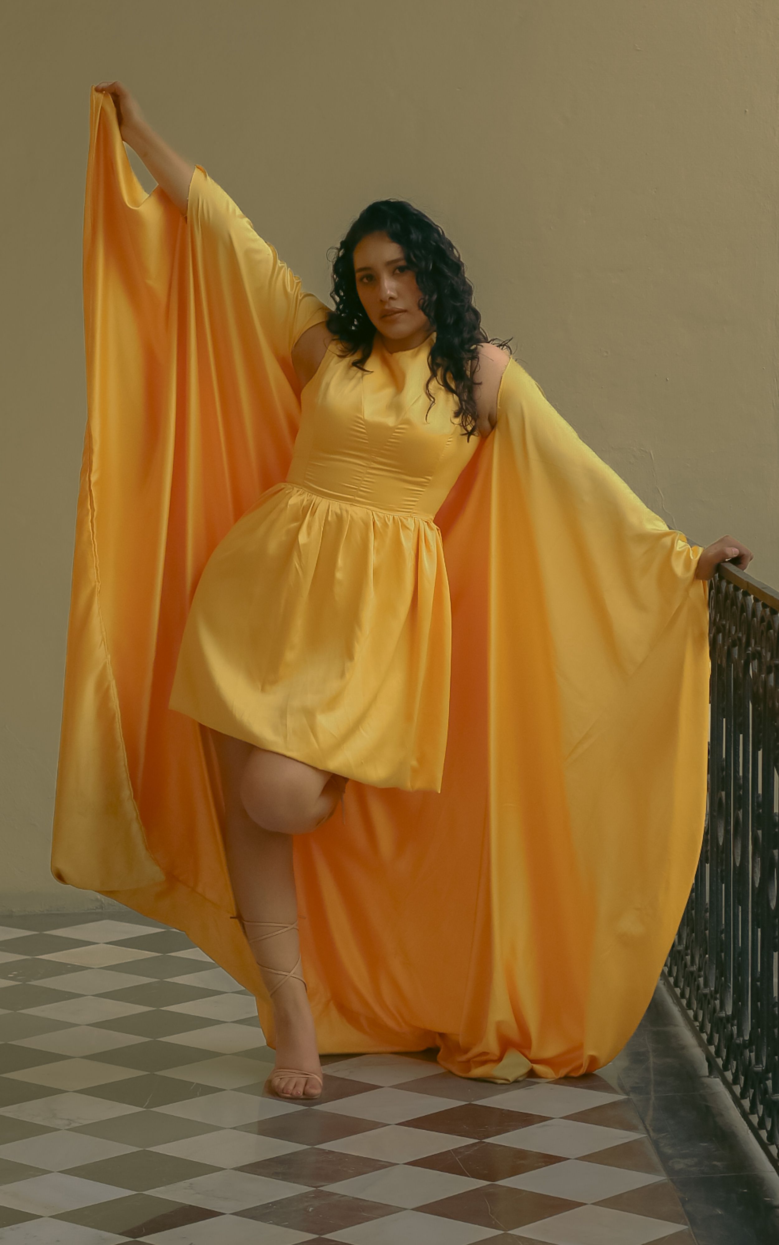Elegant Woman in Flowing Yellow Dress · Free Stock Photo