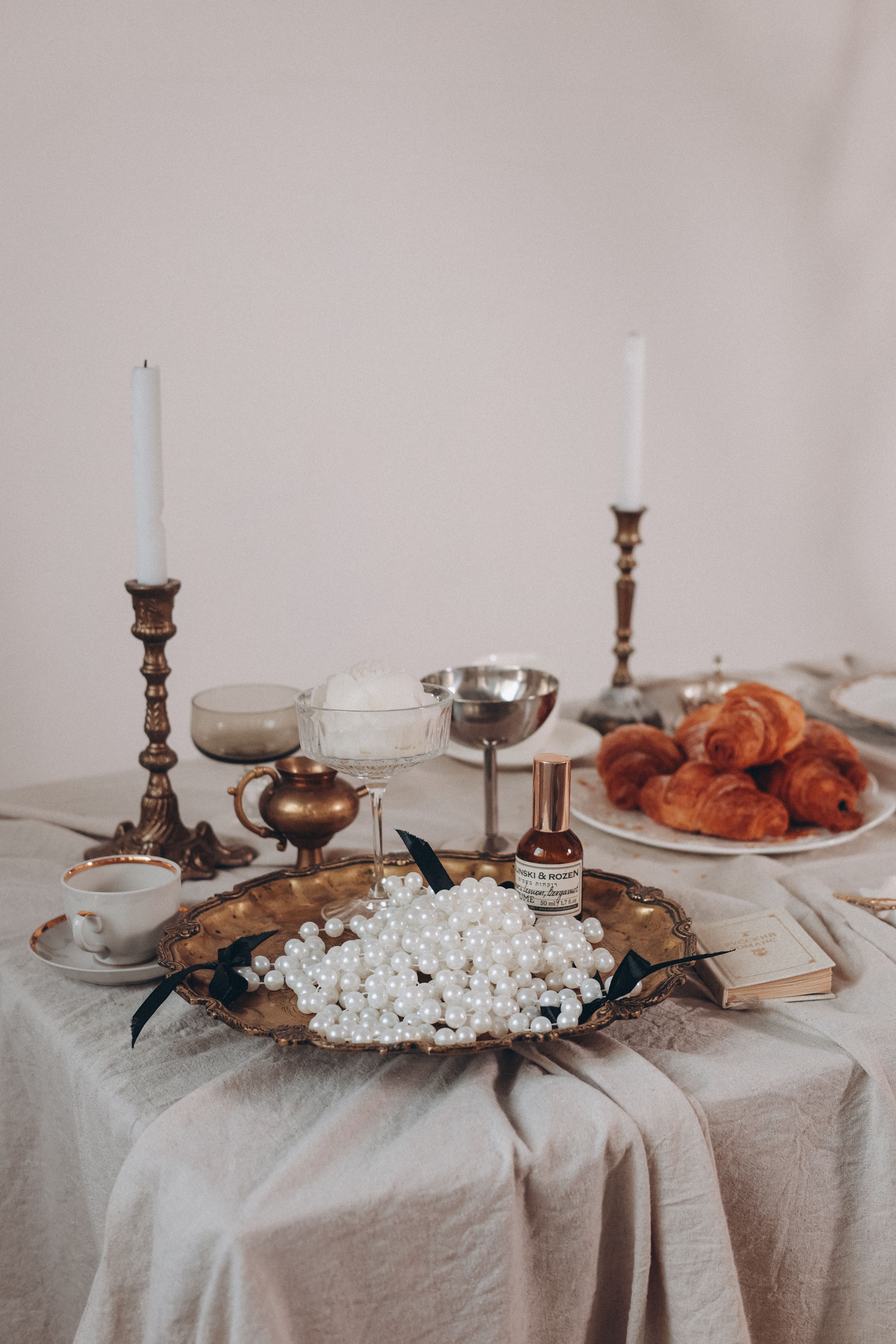 Elegant Table Setting with Pearls and Croissants · Free Stock Photo