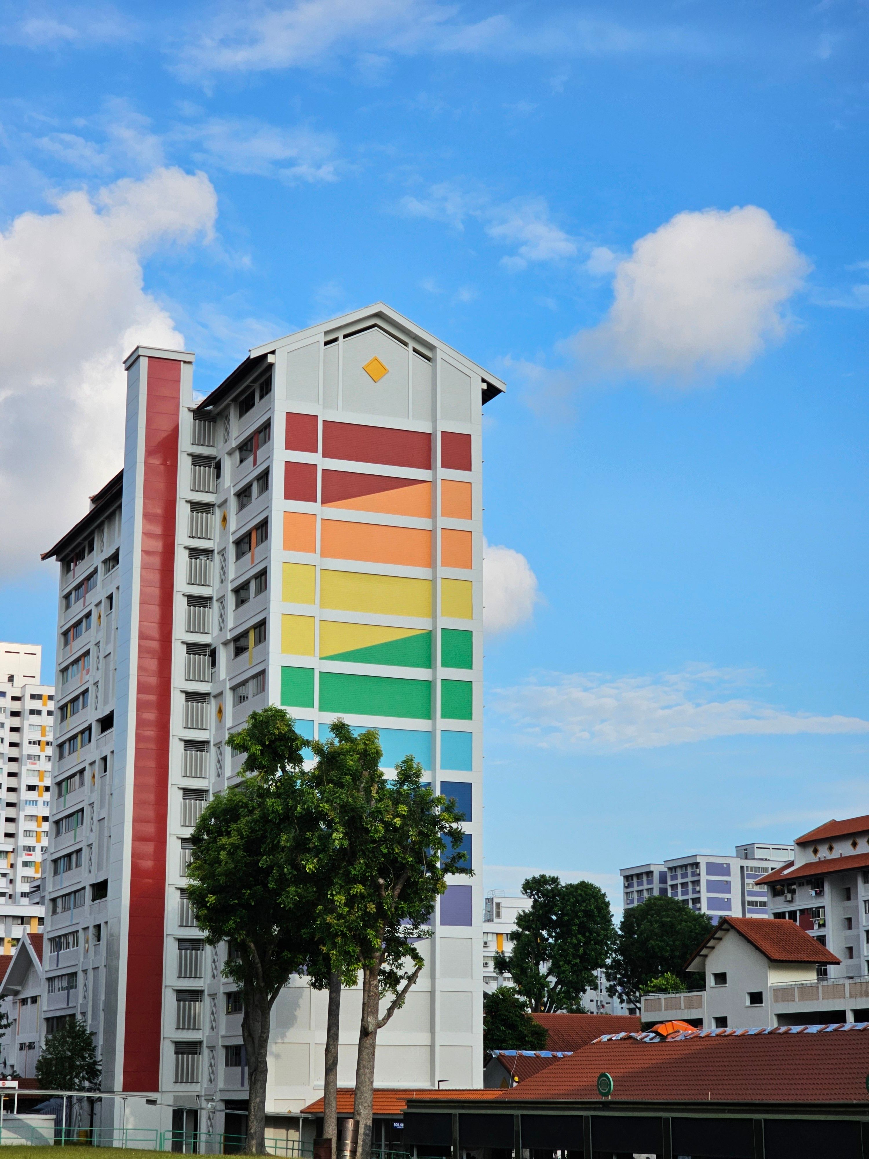 Colorful Urban High-rise against Blue Sky · Free Stock Photo