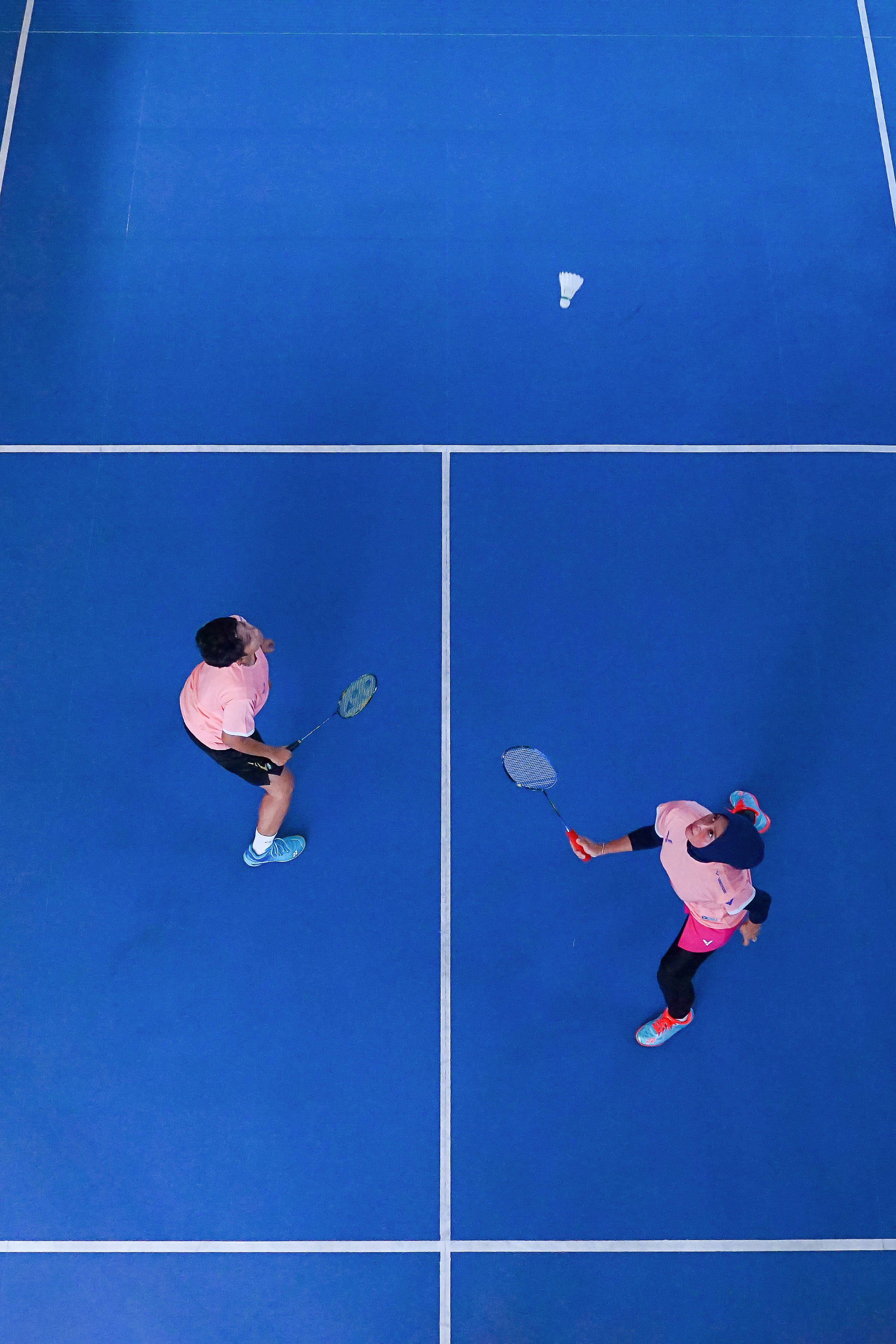 Aerial View of Badminton Players in Action · Free Stock Photo