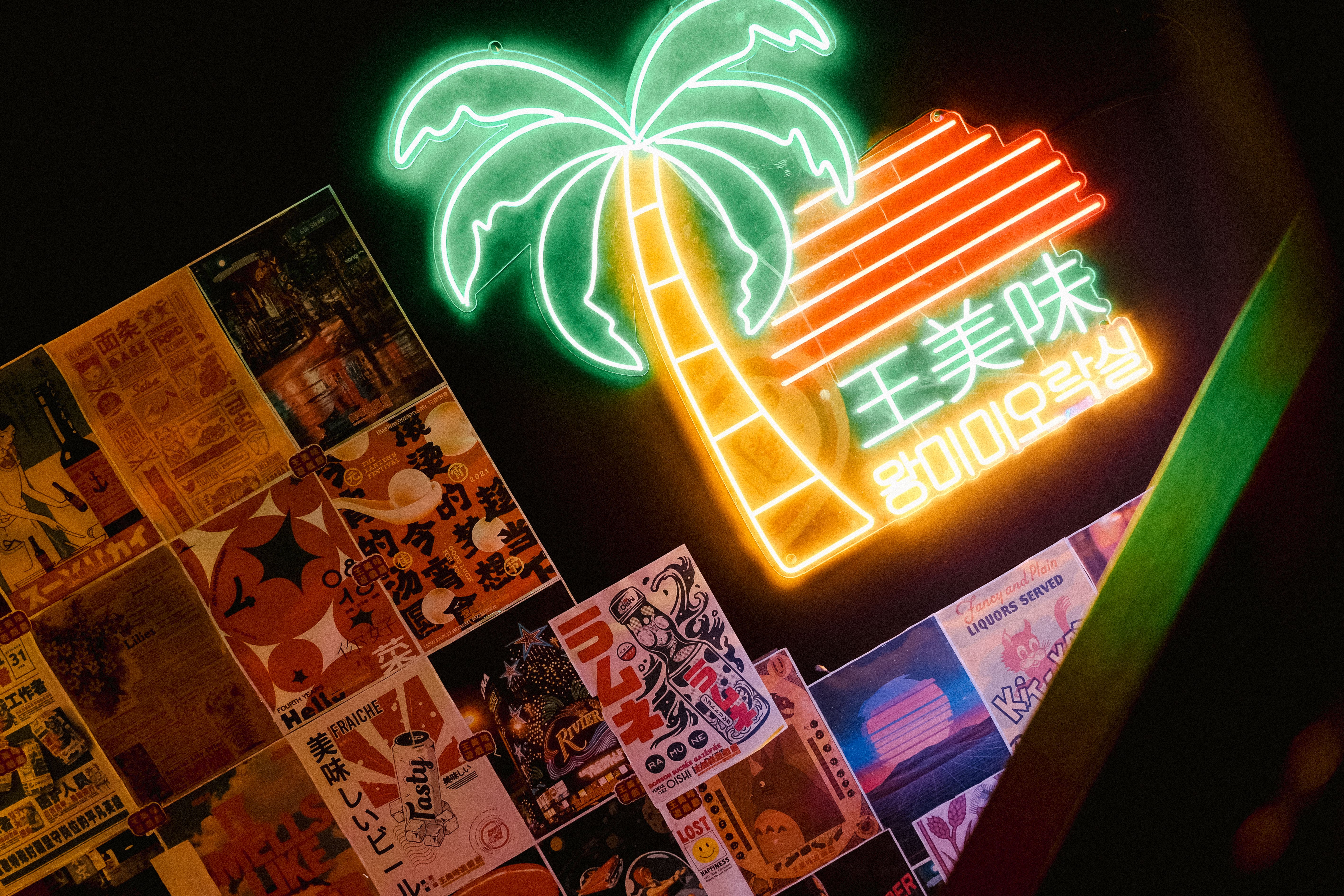 Vibrant Neon Art and Posters on Bar Wall · Free Stock Photo