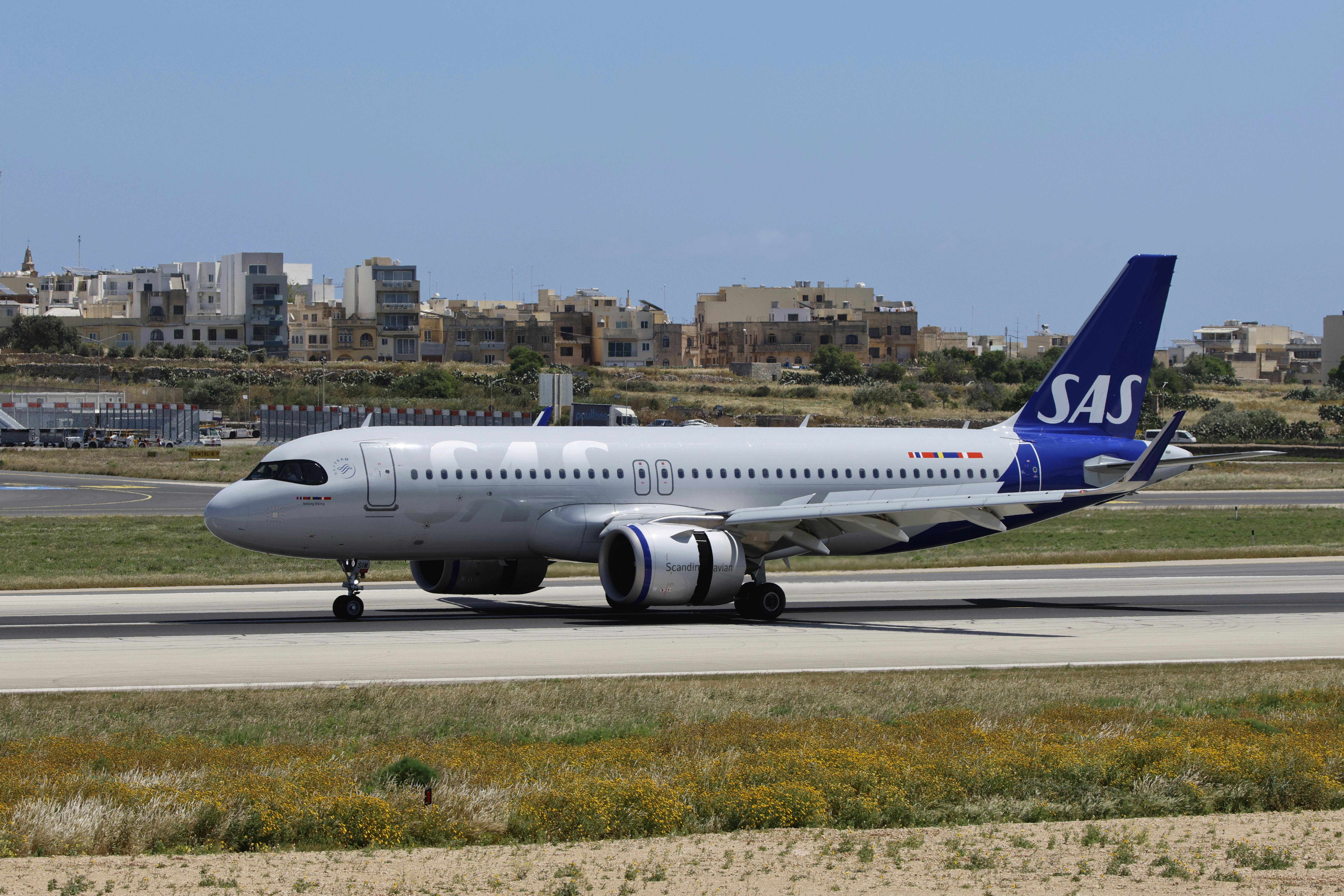 SAS Airline Plane on Runway in Sunny Weather · Free Stock Photo