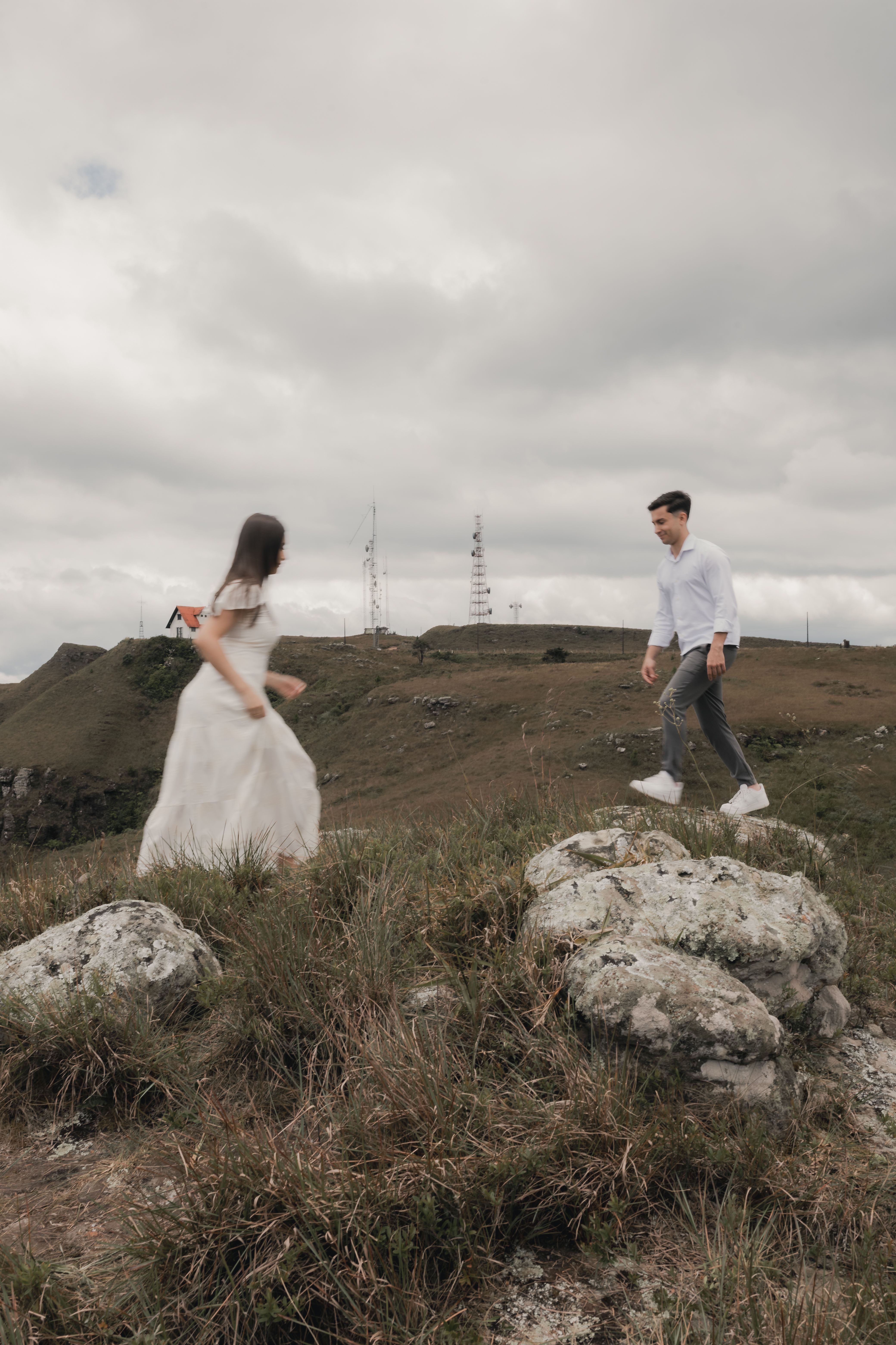 Romantic Couple Exploring Scenic Hilltop Outdoors · Free Stock Photo