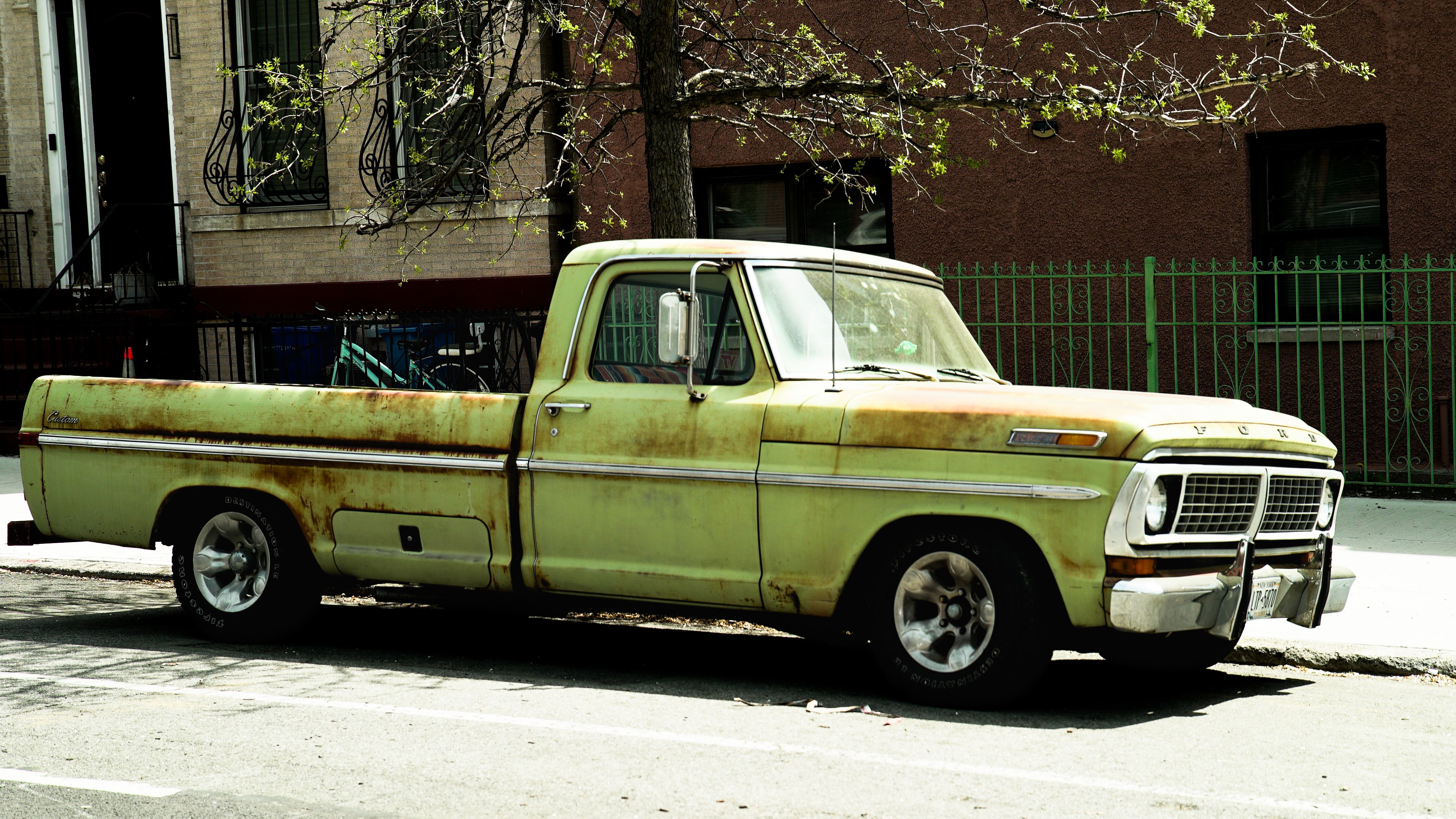 Vintage Green Pickup Truck on Urban Street · Free Stock Photo
