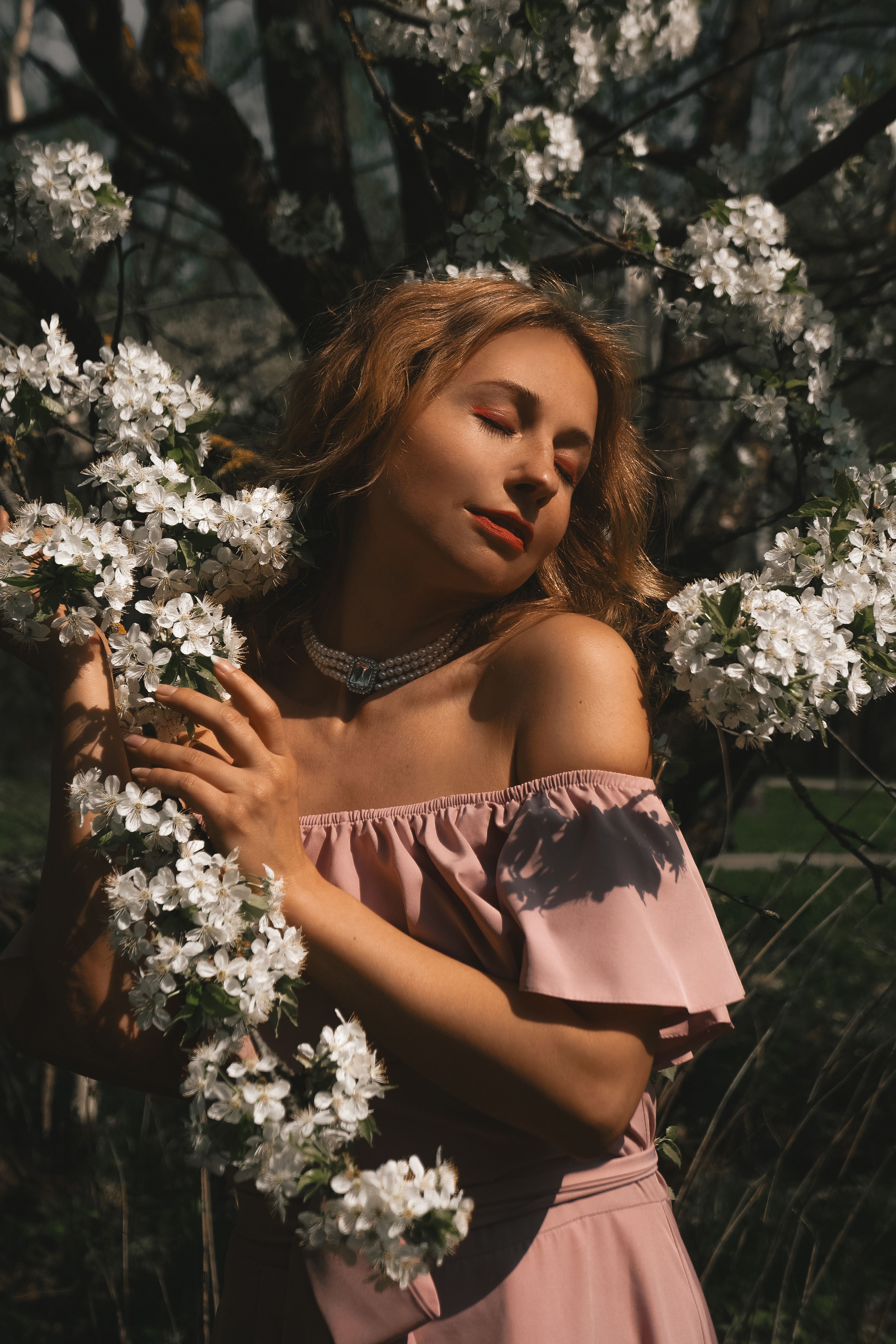 Woman in Blossom Attire Embracing Spring · Free Stock Photo