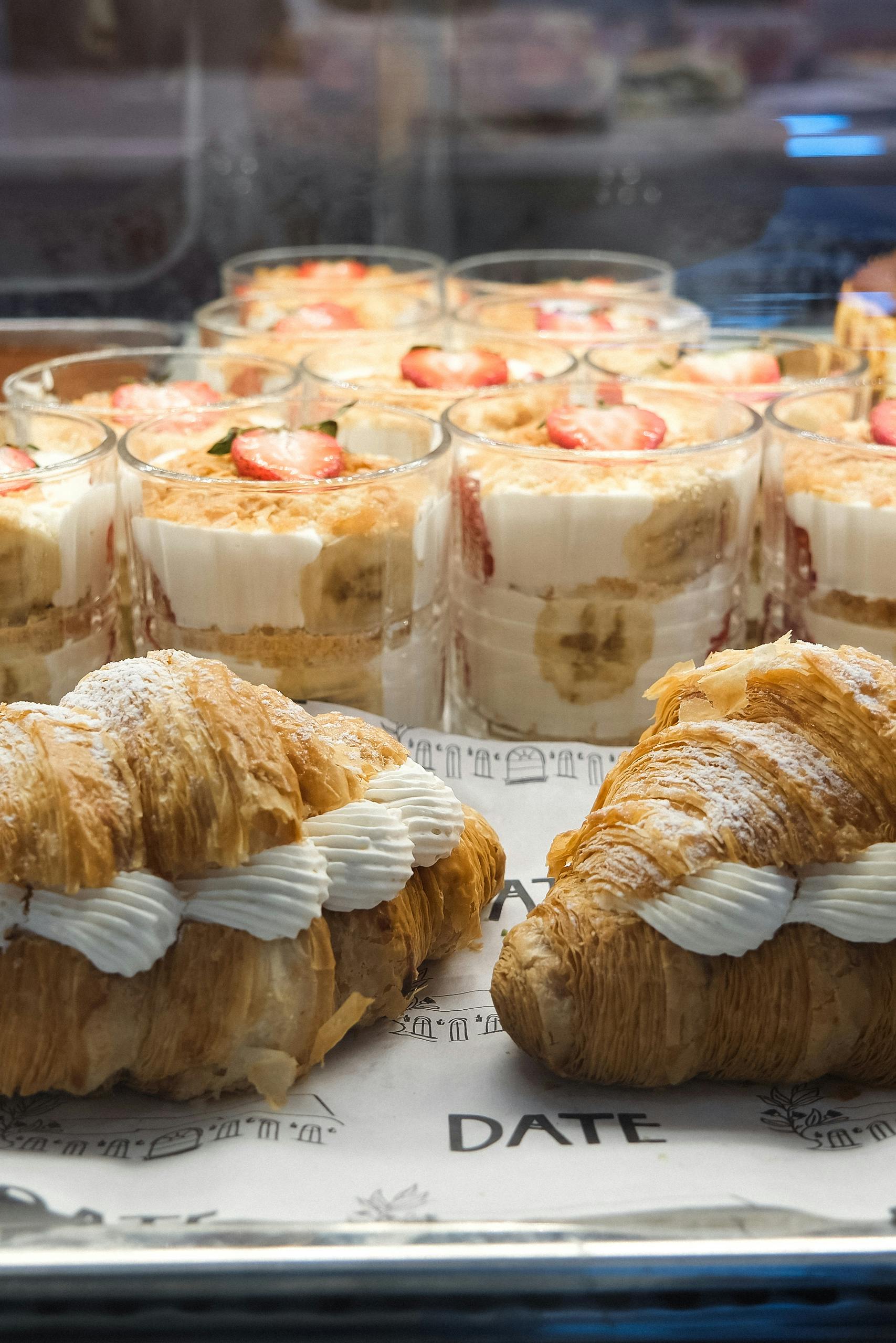 Delicious Pastries and Parfaits in Display Case · Free Stock Photo