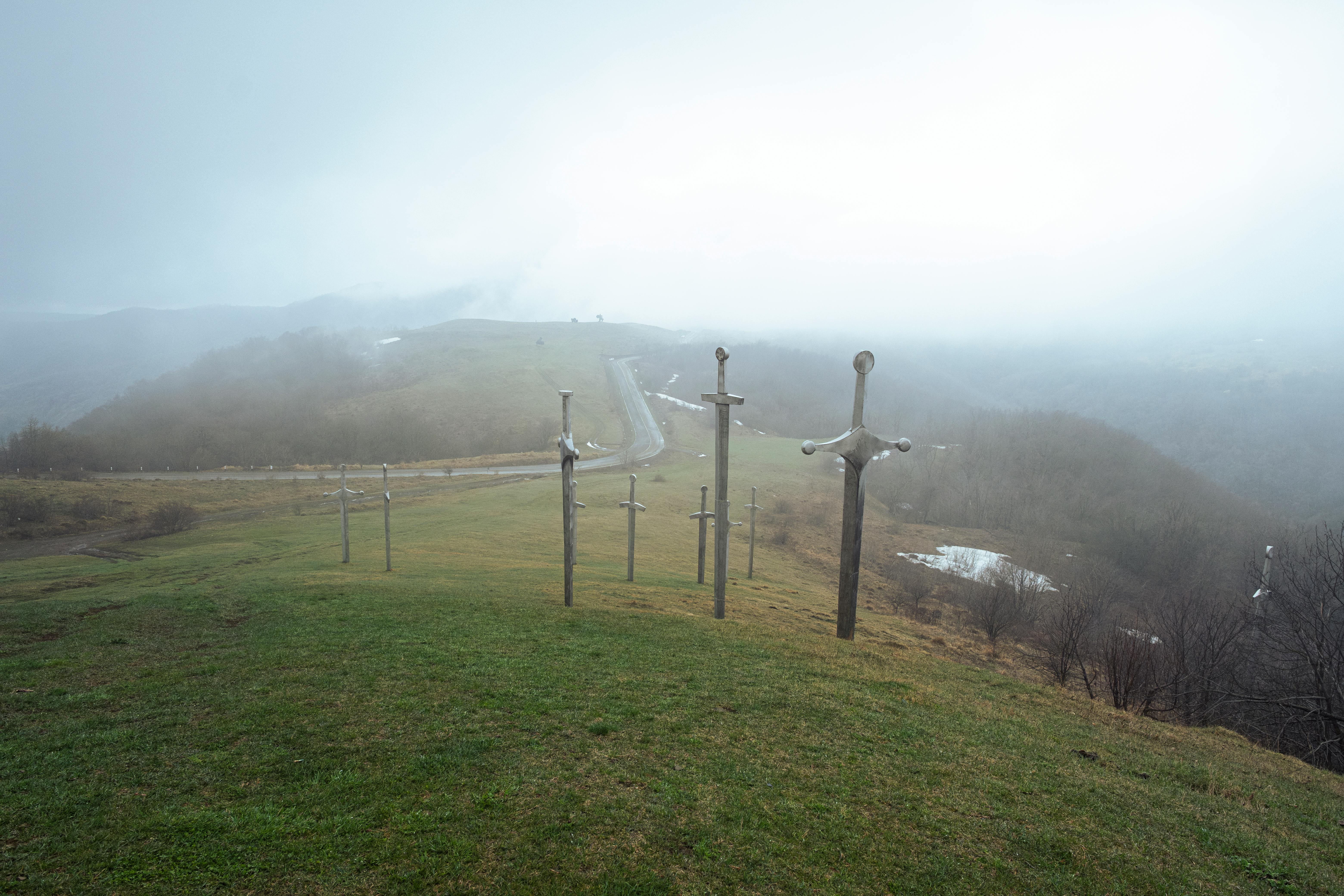 Sword Monuments in Misty Georgian Landscape · Free Stock Photo