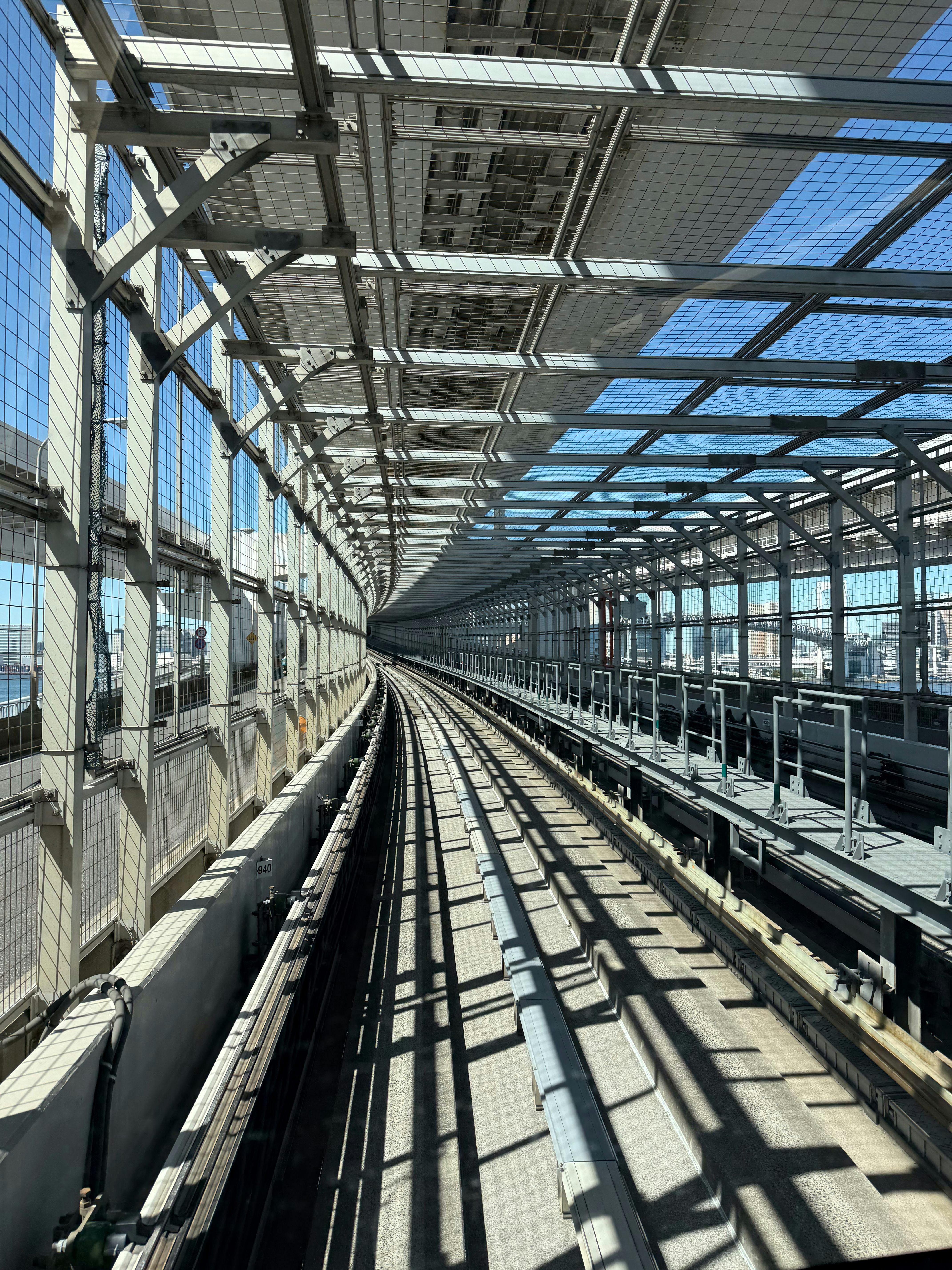 Curved Urban Rail Track under Steel Structure · Free Stock Photo