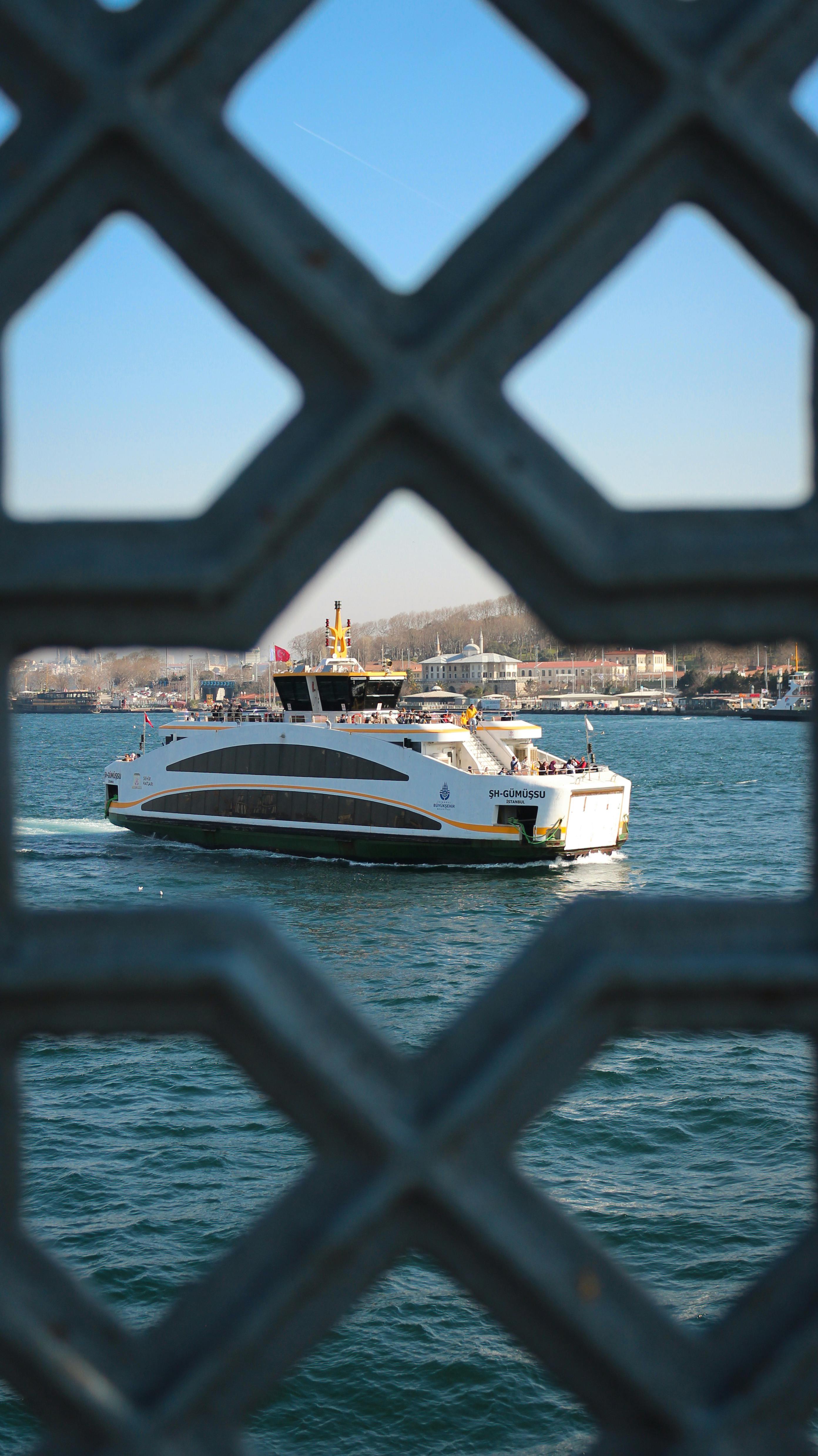 Scenic View of Ferry Through Architectural Frame · Free Stock Photo
