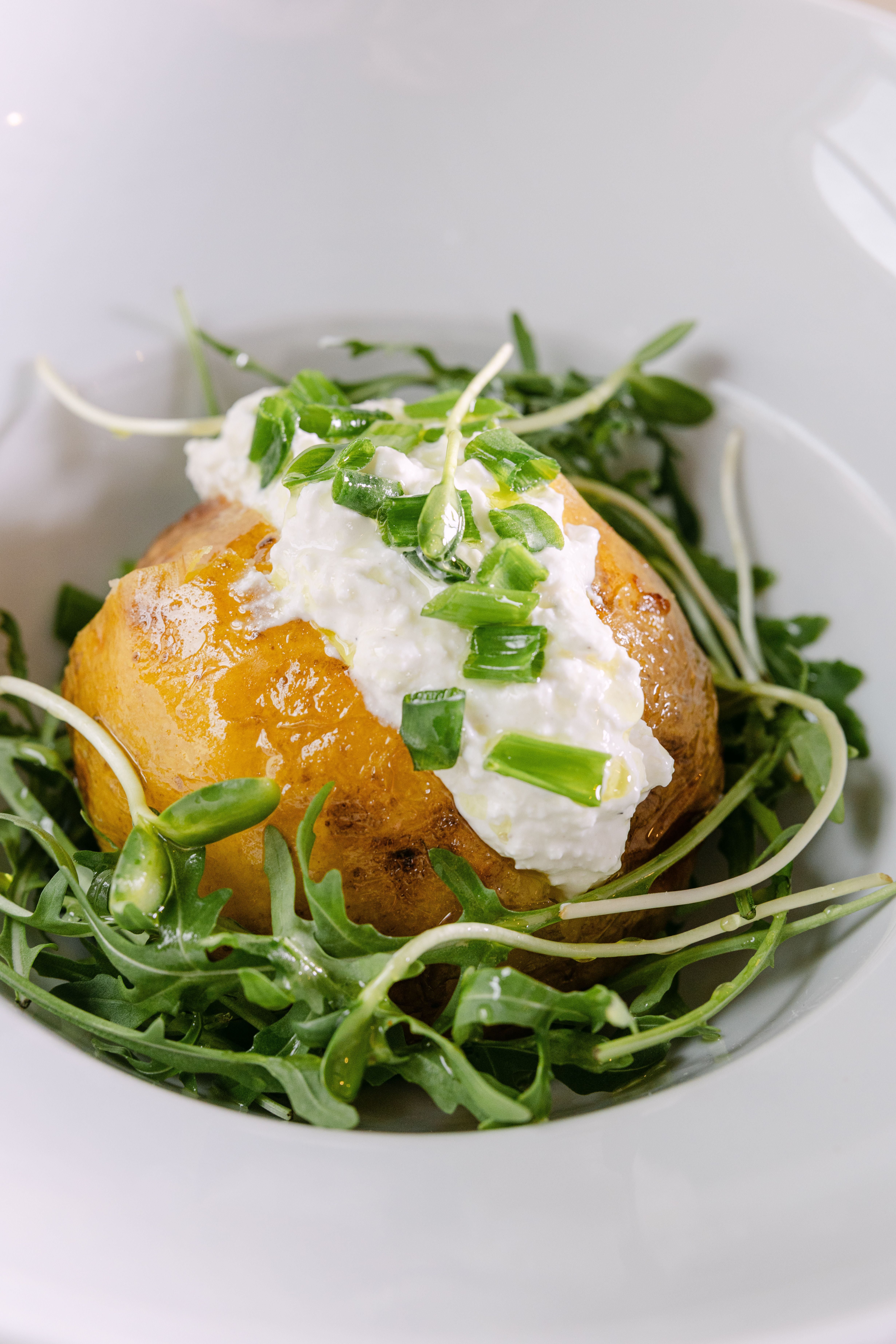 Gourmet Baked Potato with Cheese and Greens · Free Stock Photo