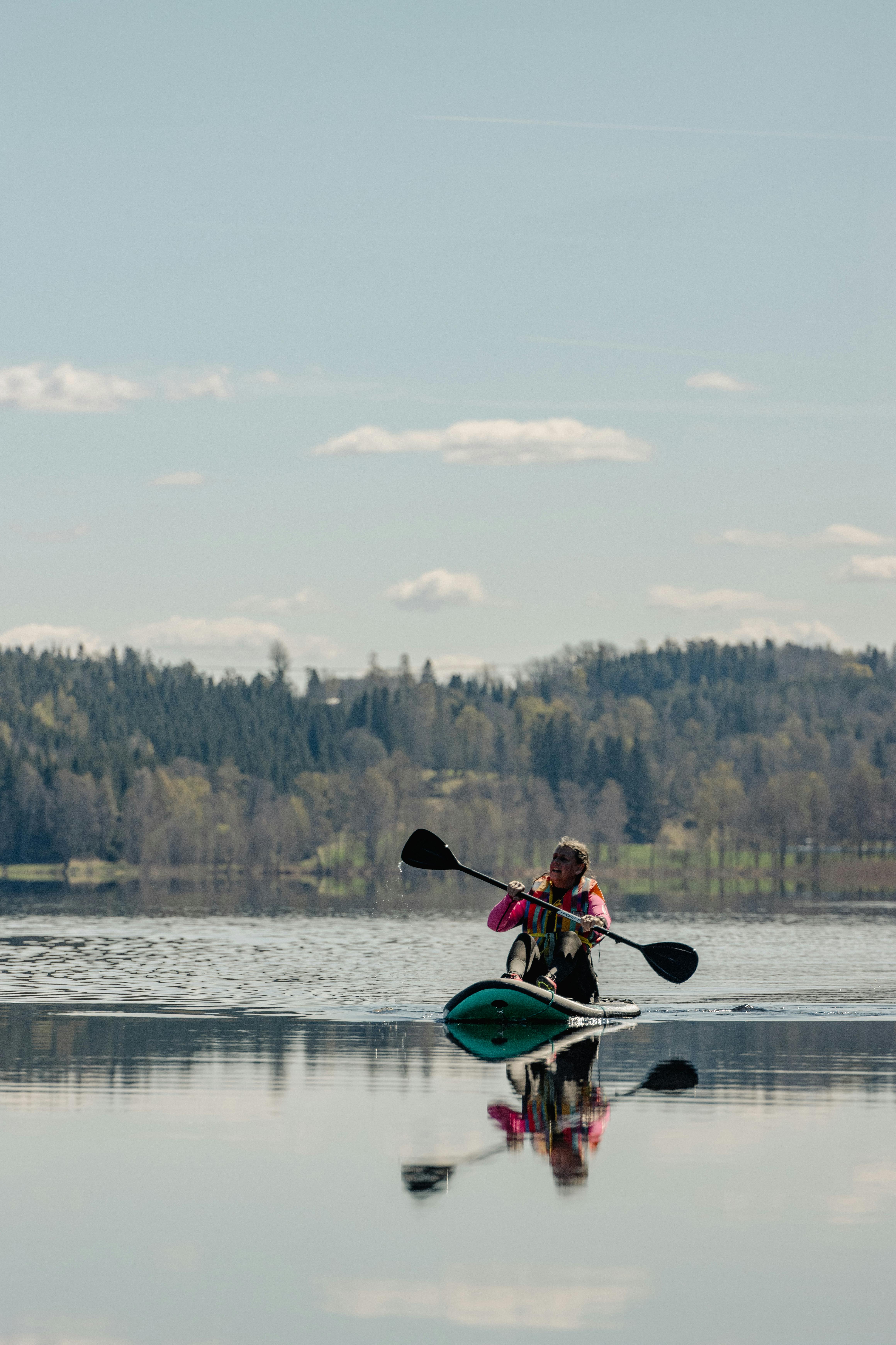 Serene Kayaking on Lake in Tenhult, Sweden · Free Stock Photo