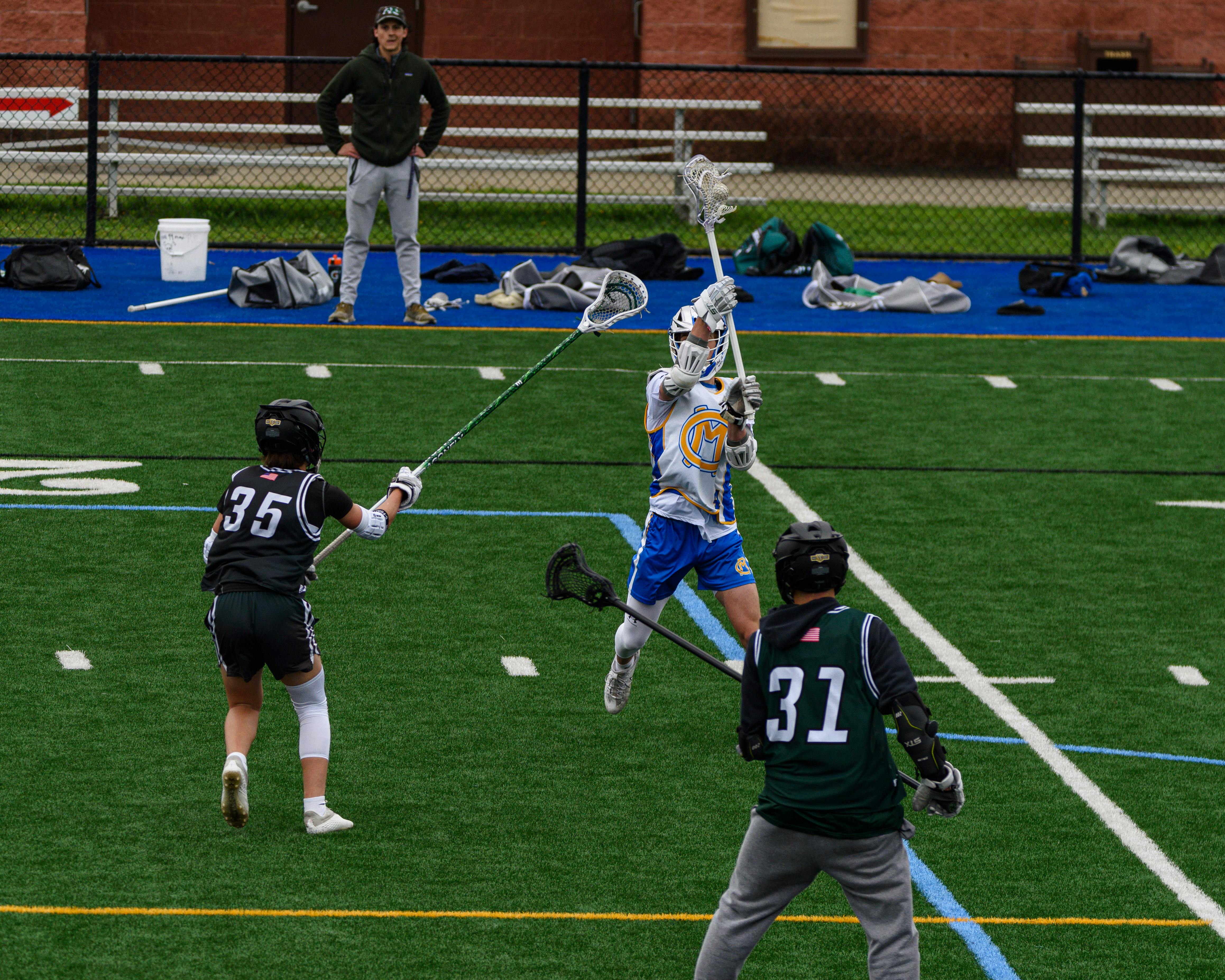 Intense Outdoor Lacrosse Game Action · Free Stock Photo